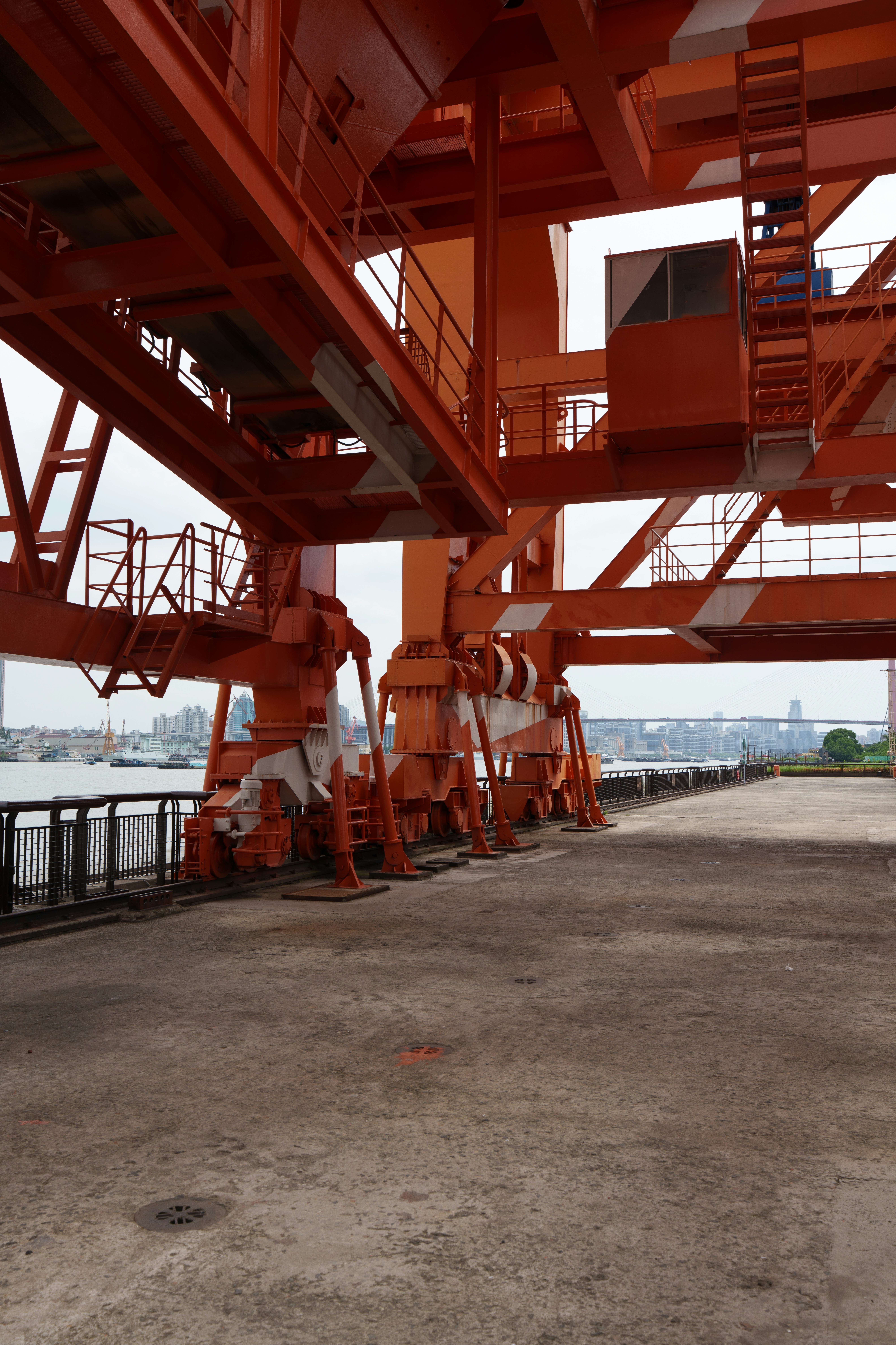 Crisscross Iron: A Red Industrial Landscape by the Waterfront