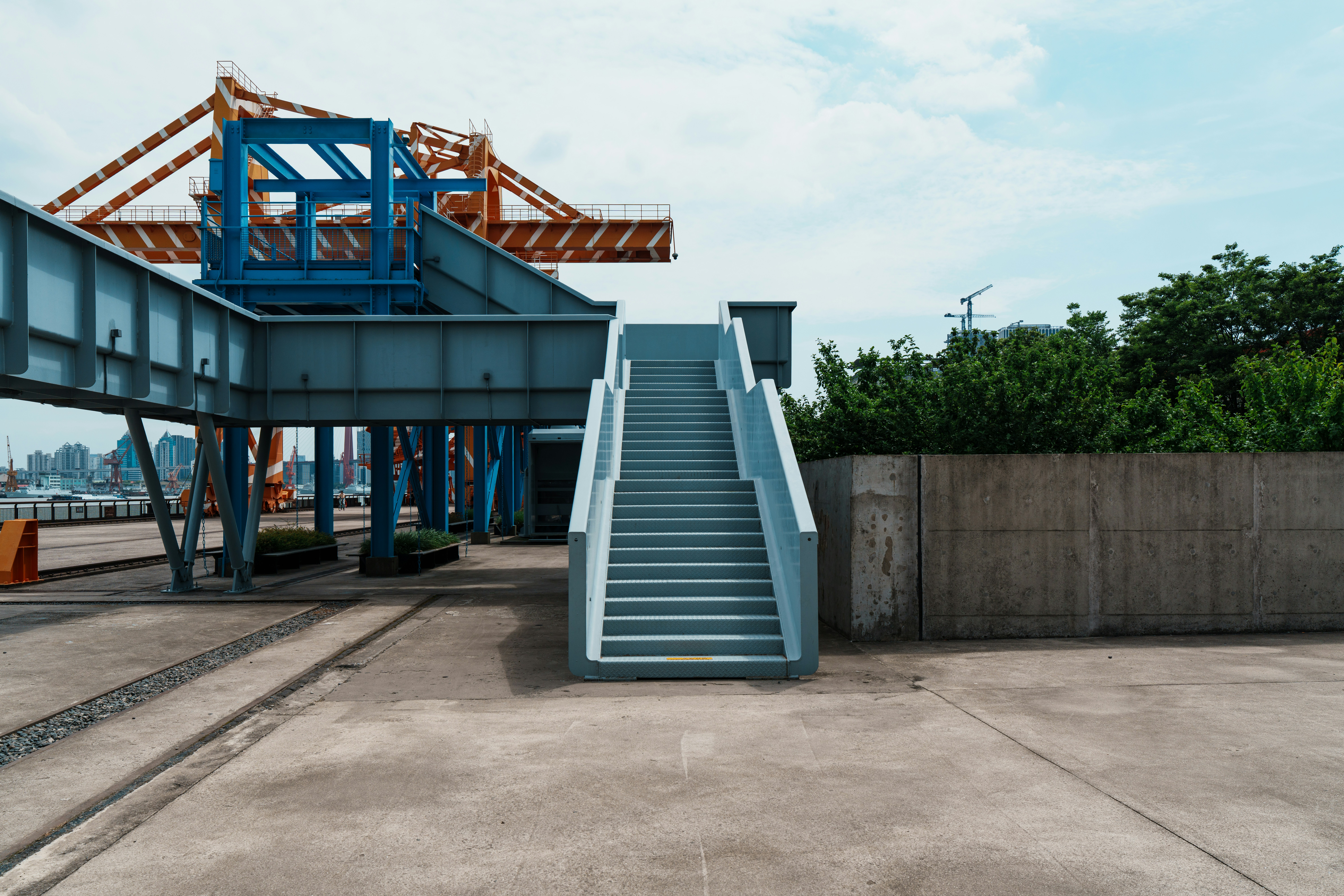 Blue Staircase to the Pier: Geometric Steel and Concrete