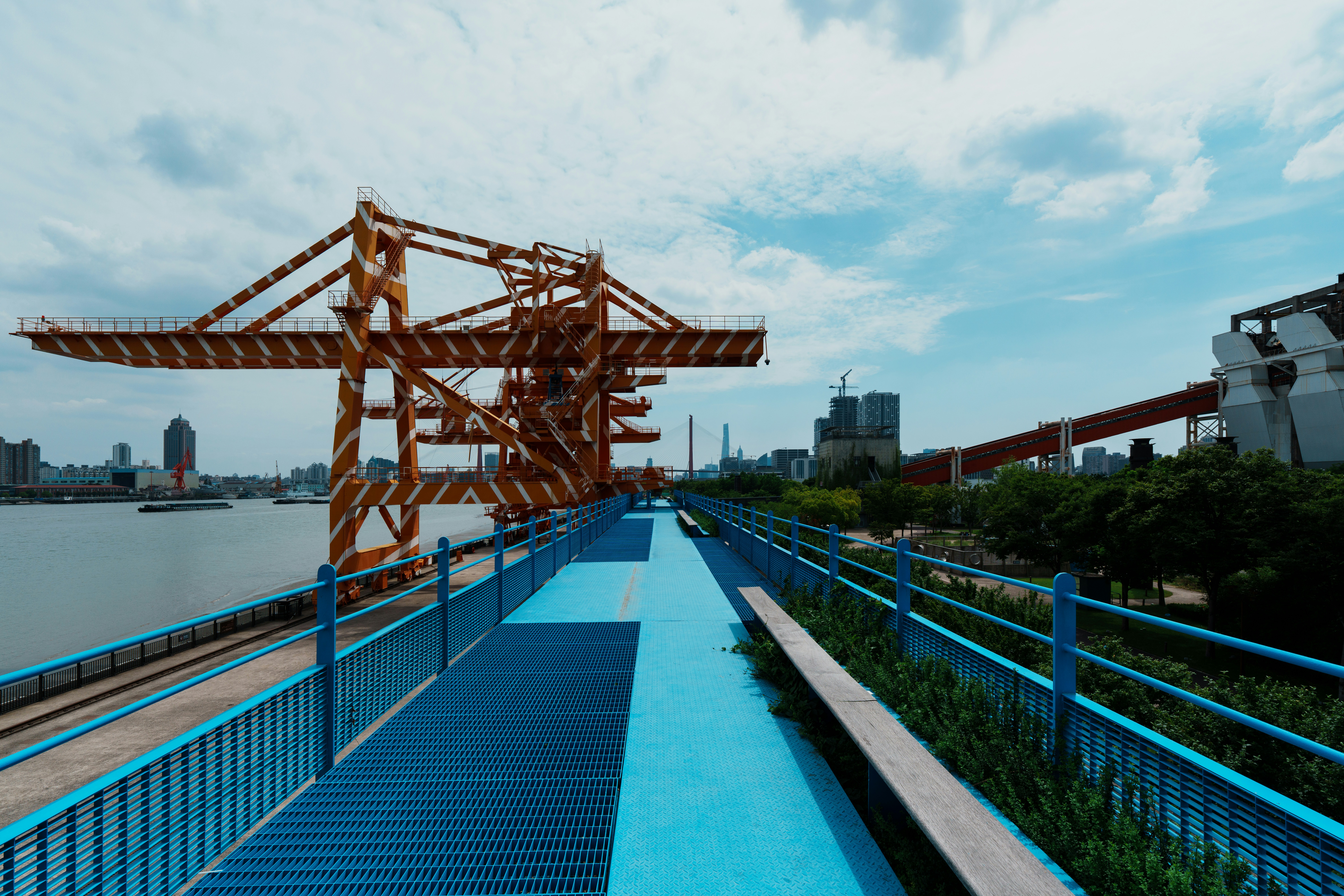 Blue Sky Over the Structural Gears: A Walkway to a Distant City