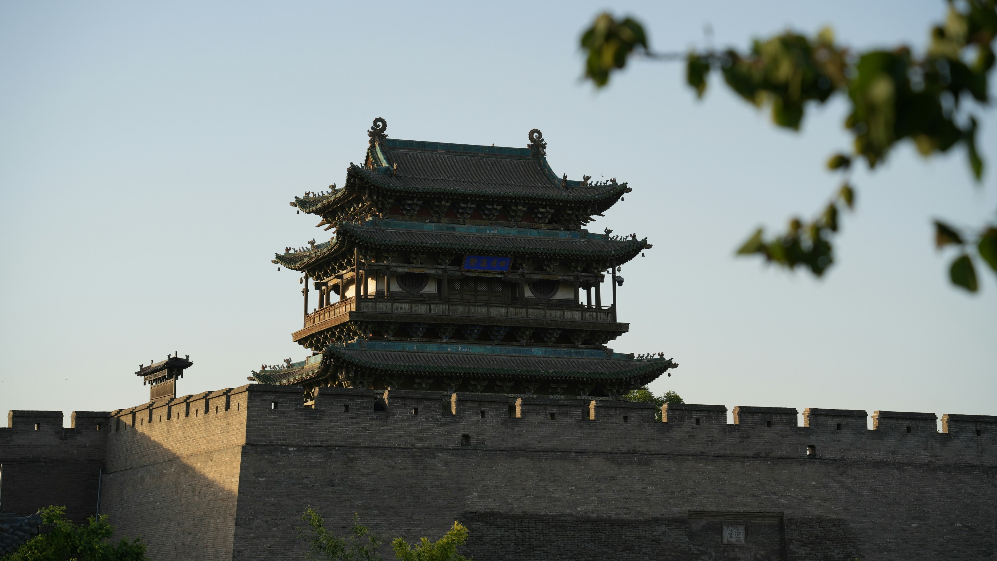 Ancient chinese gate tower on a stone wall.