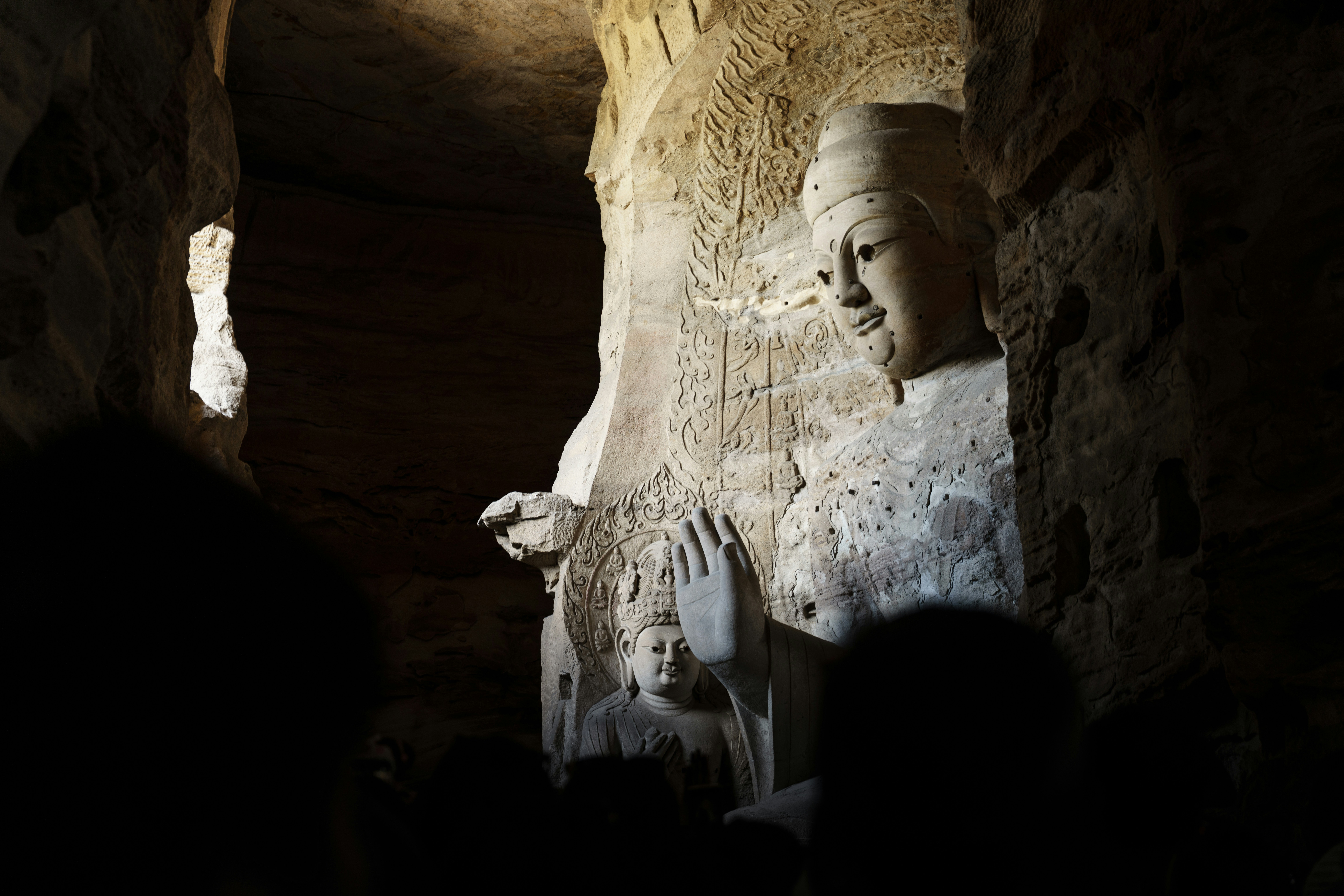 Whispers in the Underground: Stone Buddhas Beneath the Gloom