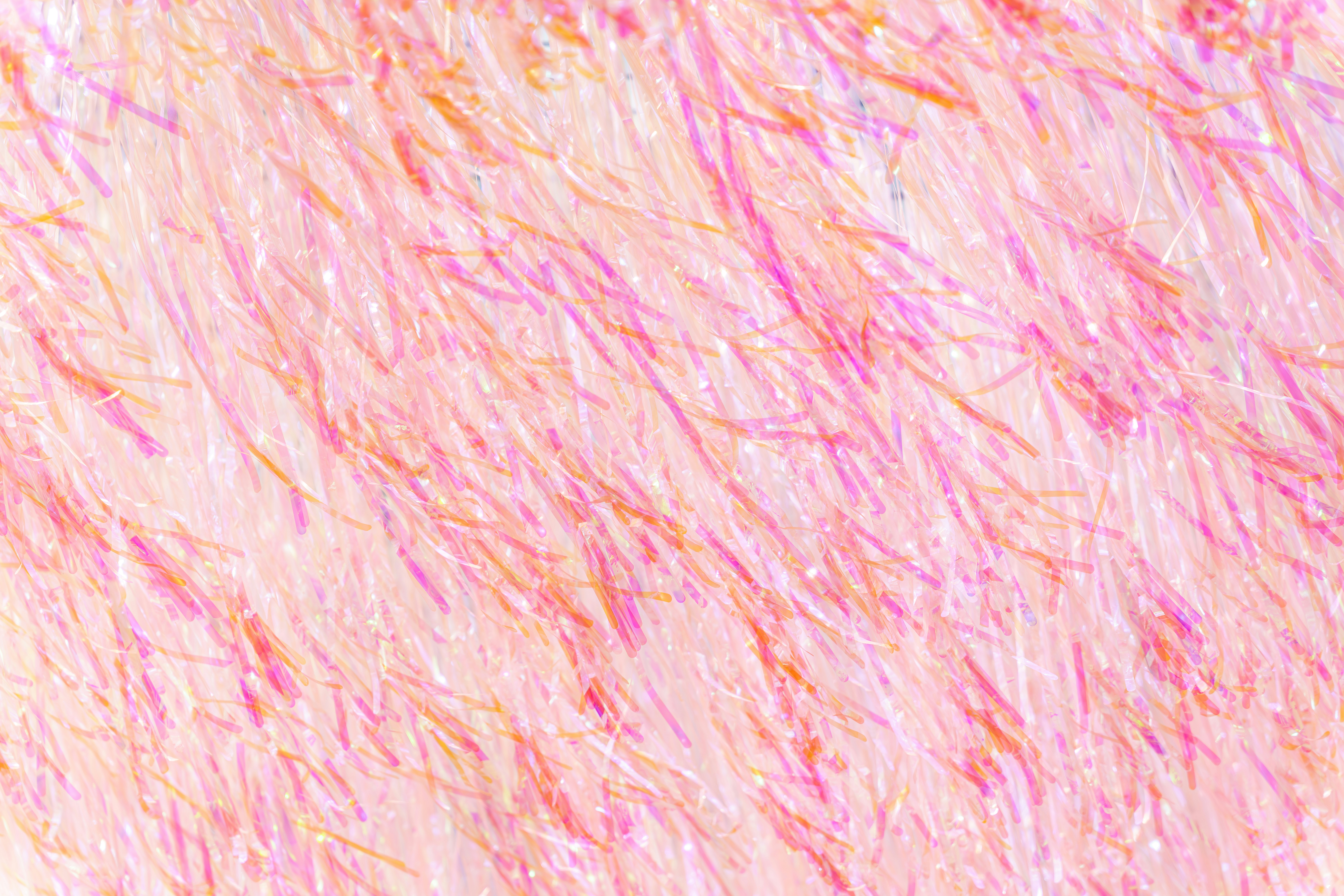 Light pink and orange abstract fibrous texture.
