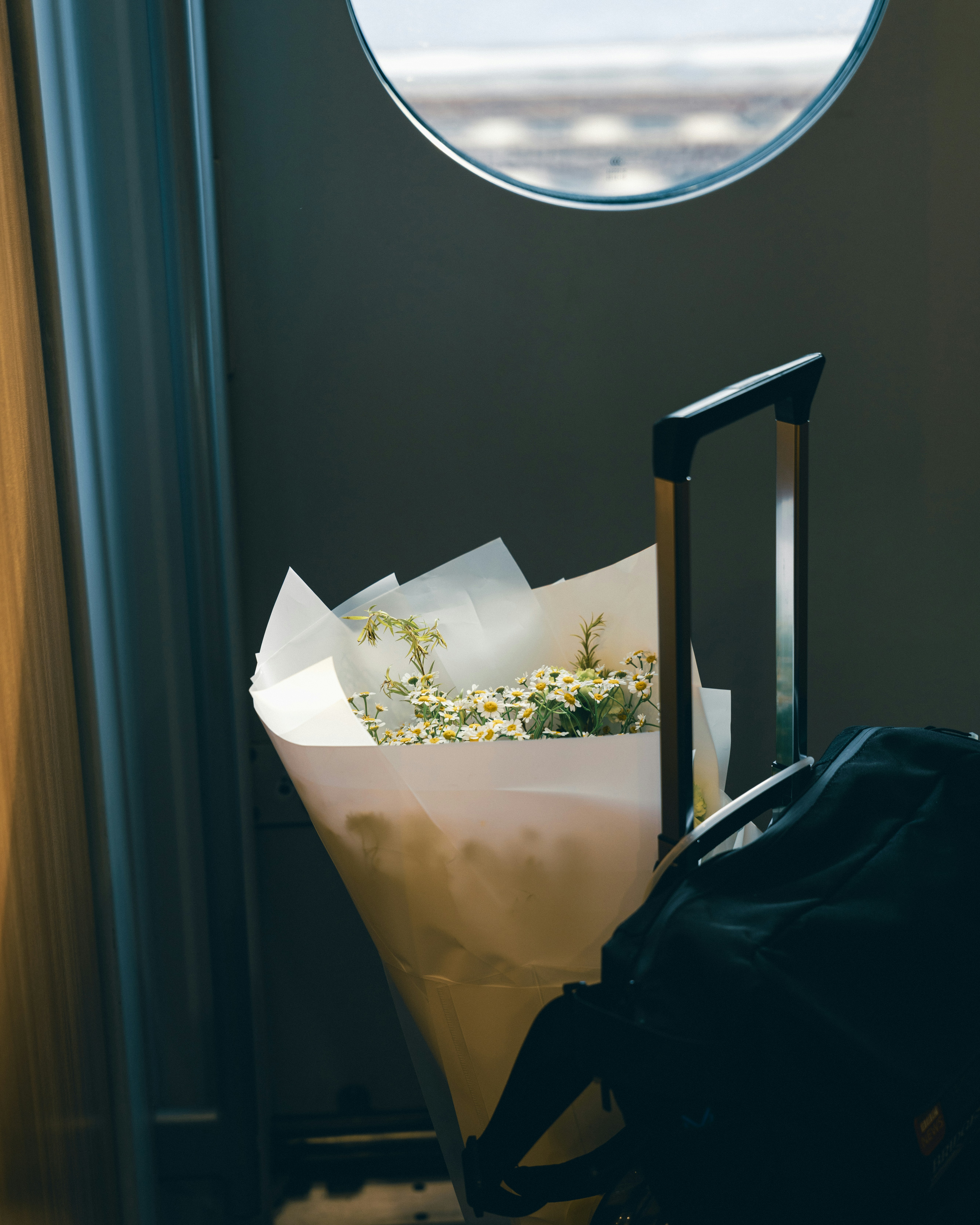 Bouquet by the Window: Flowers Await the Next Stop