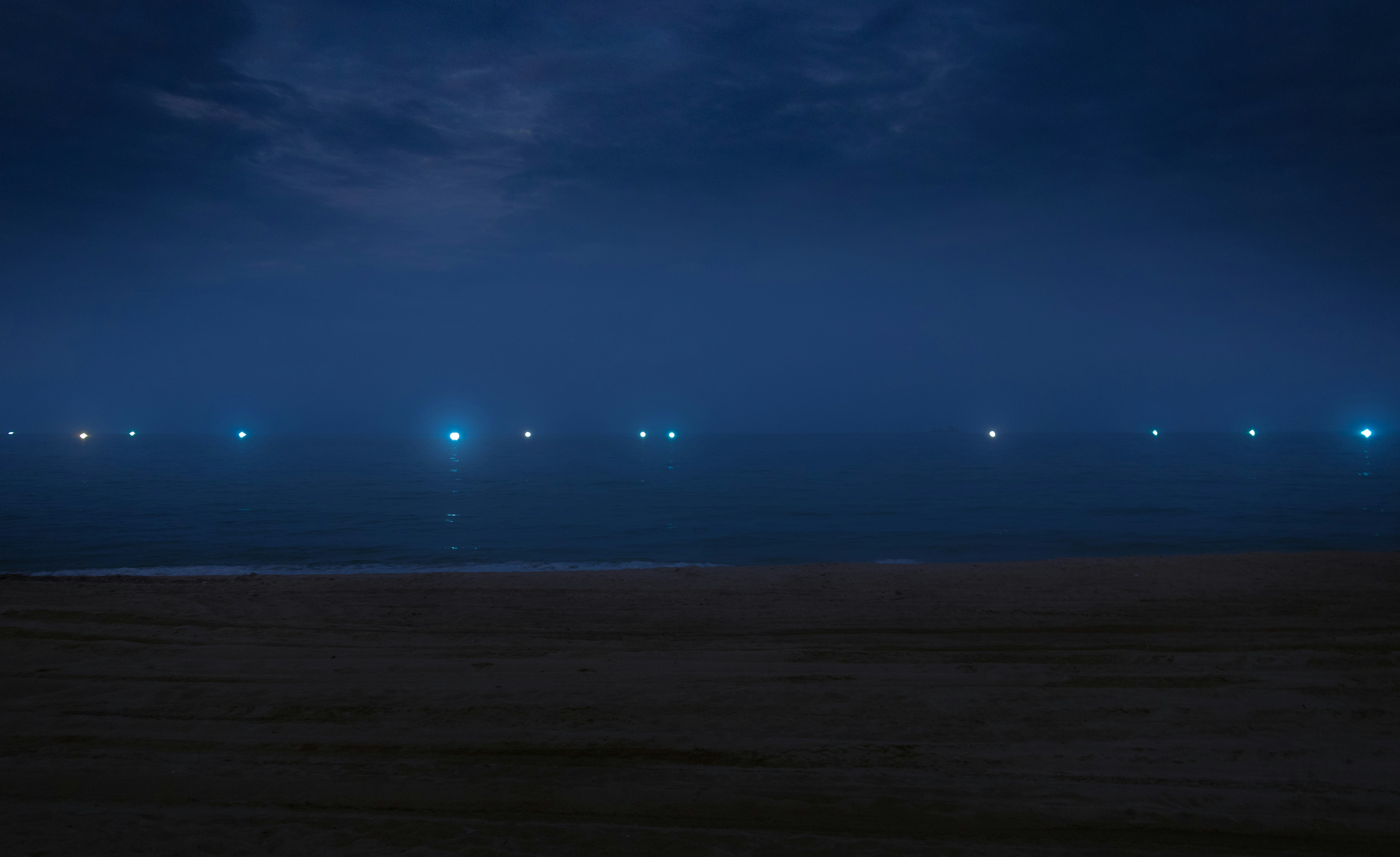 Midnight Bay Lights: Distant Beacons Across Quiet Surf