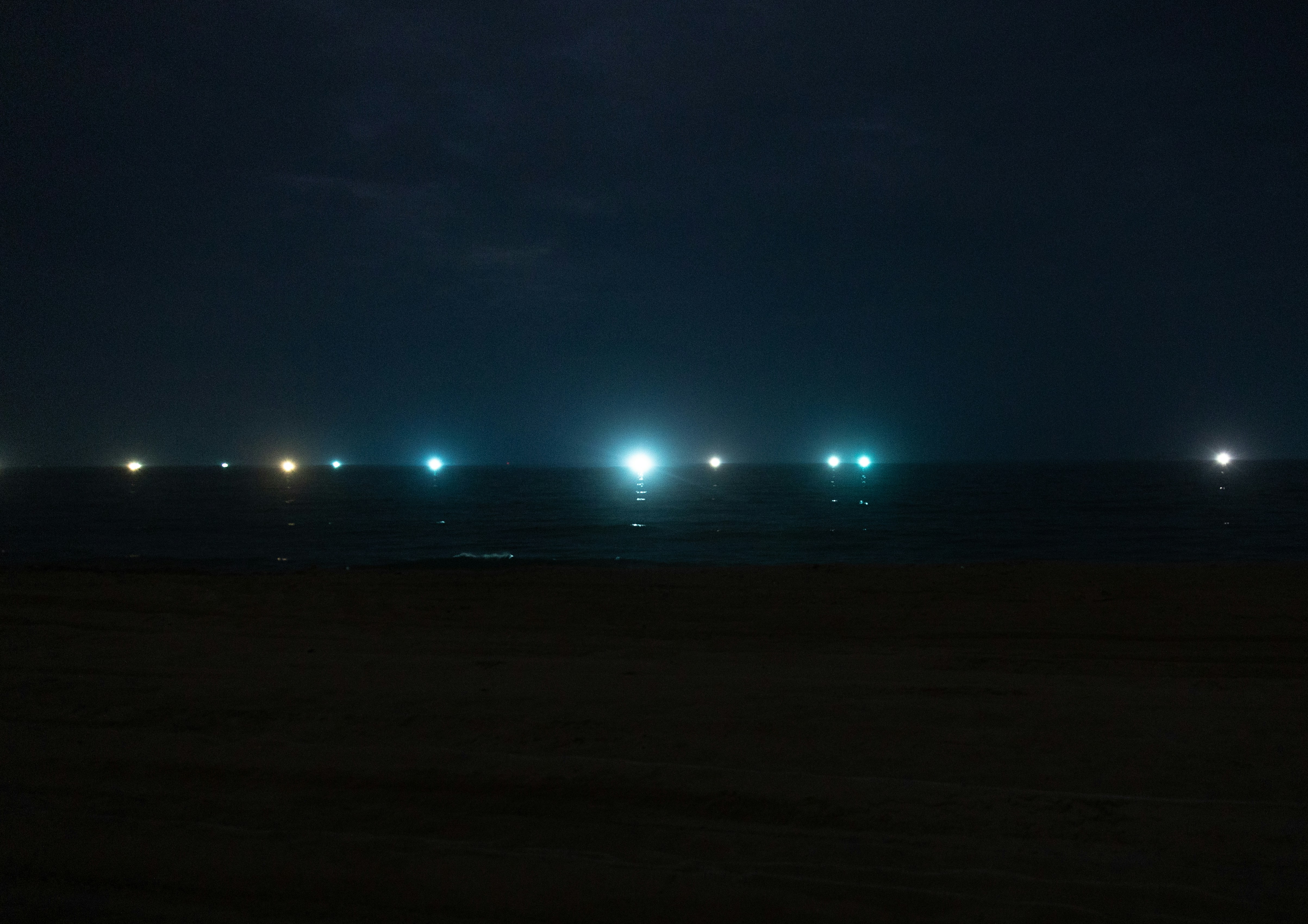 Midnight Lighthouse: Distant Beacons Across a Quiet Shore