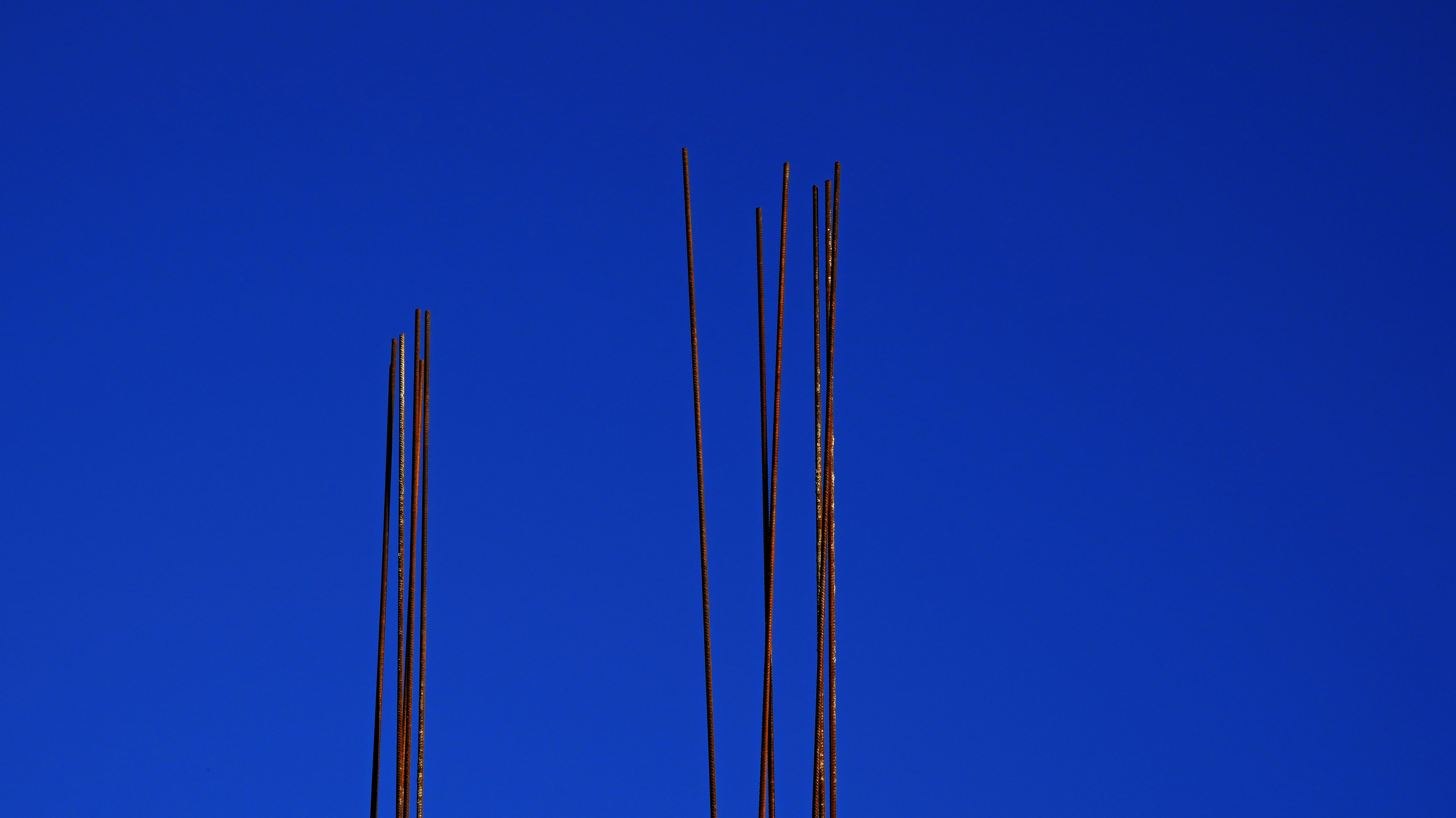 Vertical Rods in a Cerulean Sky