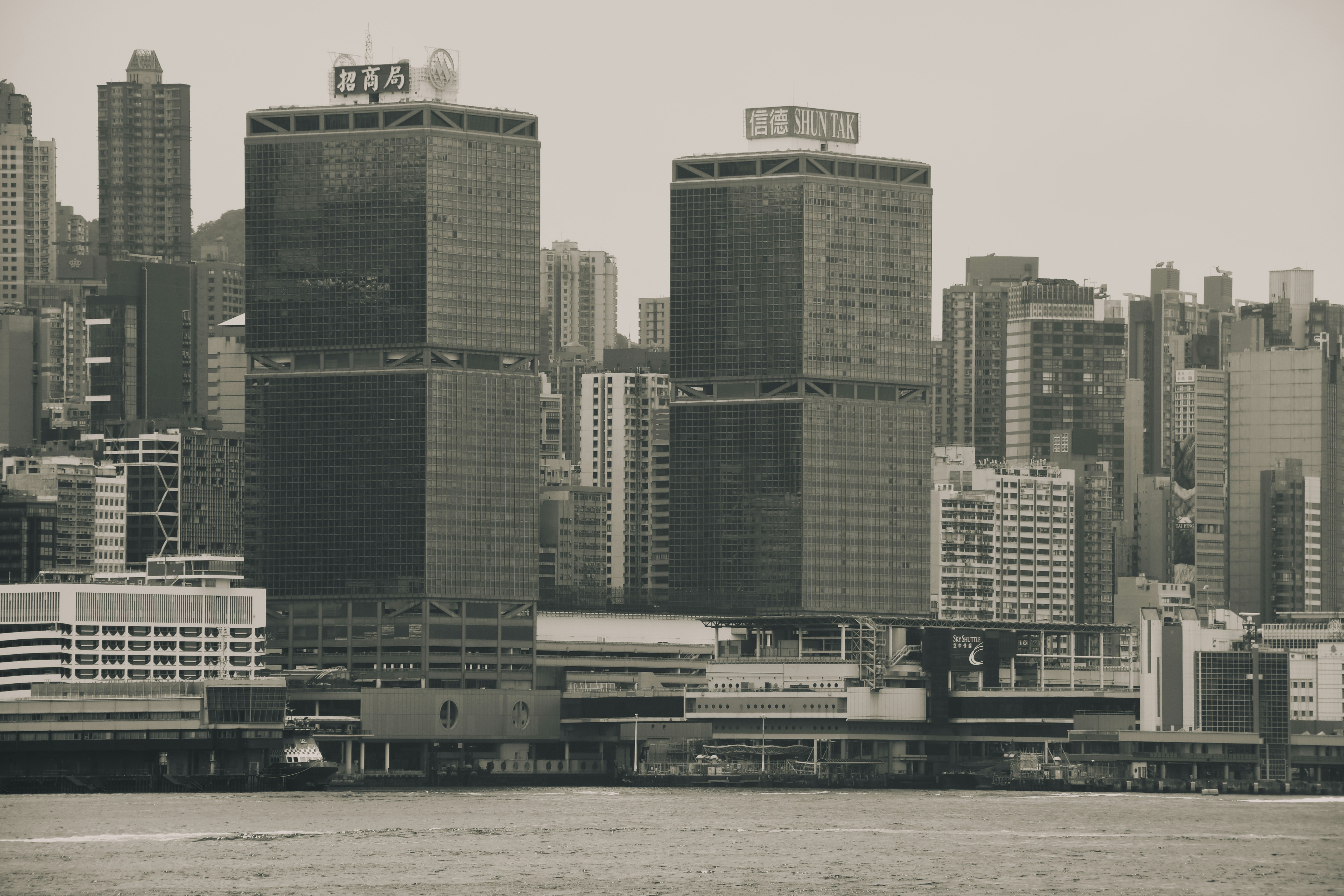 Harbor of Glass and Steel: Twin Towers Against a Distant Skyline