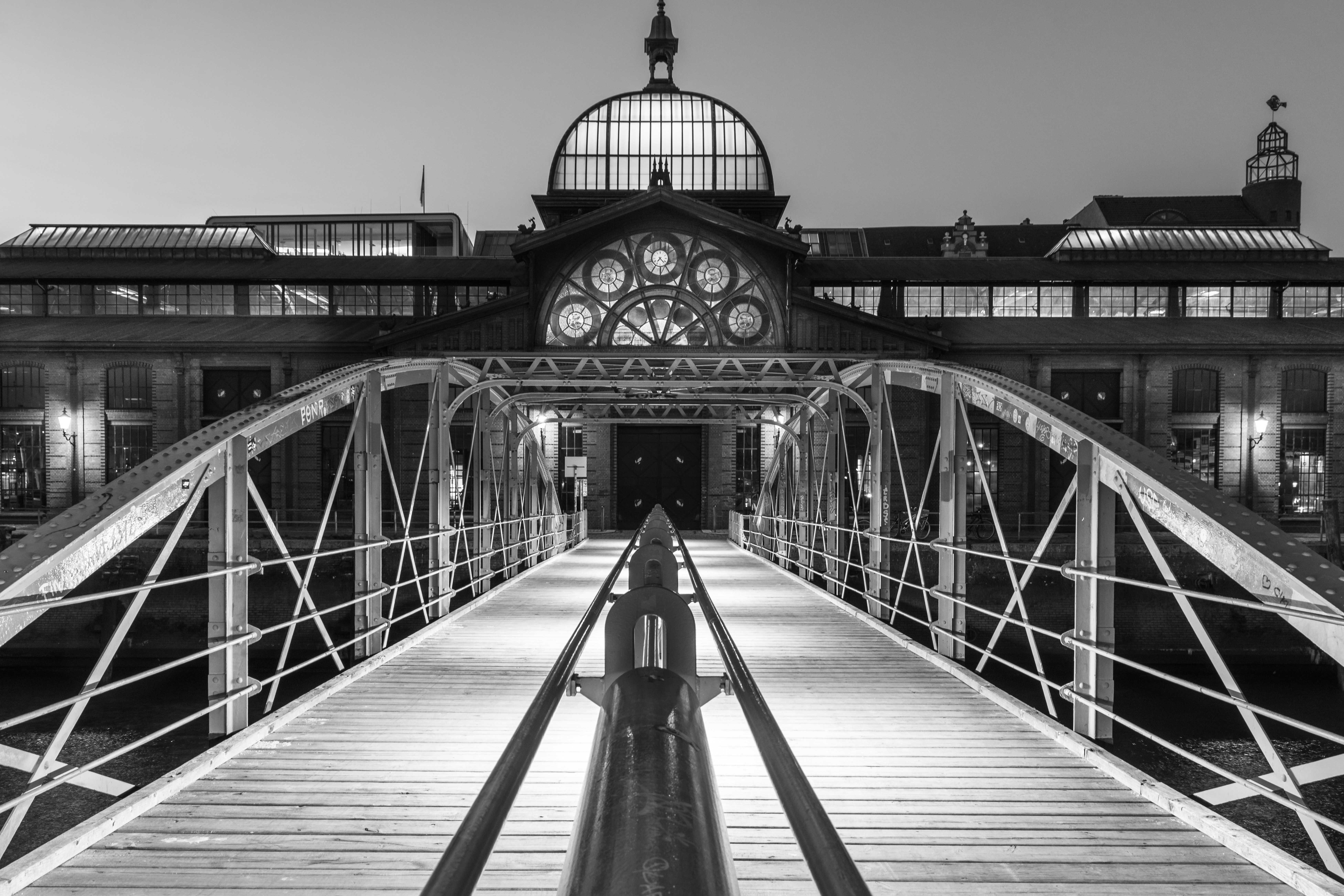 Symmetrical Ironwork Conductor: A Central Bridge to the Grand Glass Pavilion