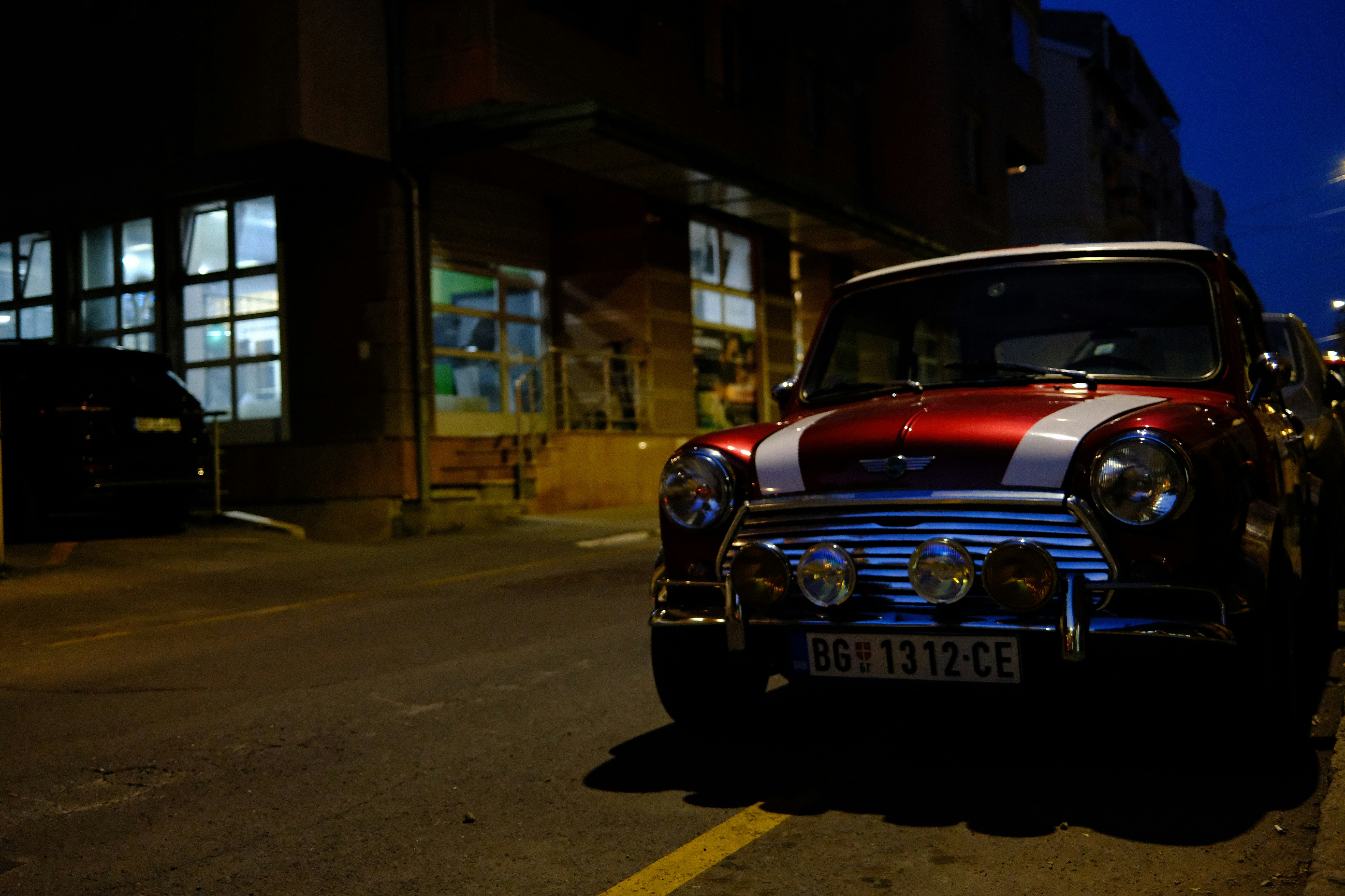 Night Street Glory: A Classic Car Awaits in Neon Glow