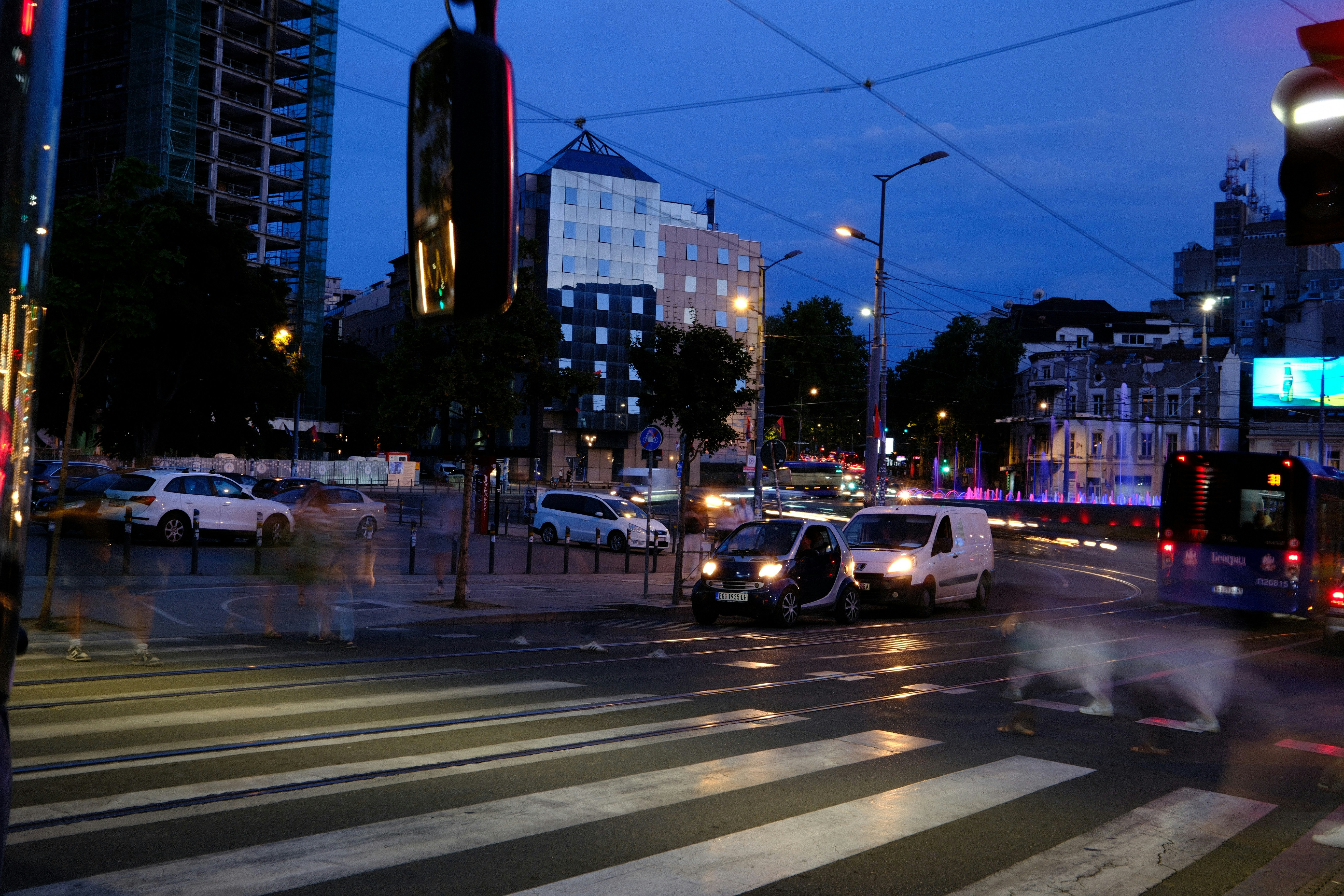 Dusk City Crossing: Trains, Taxis, and Neon Trails