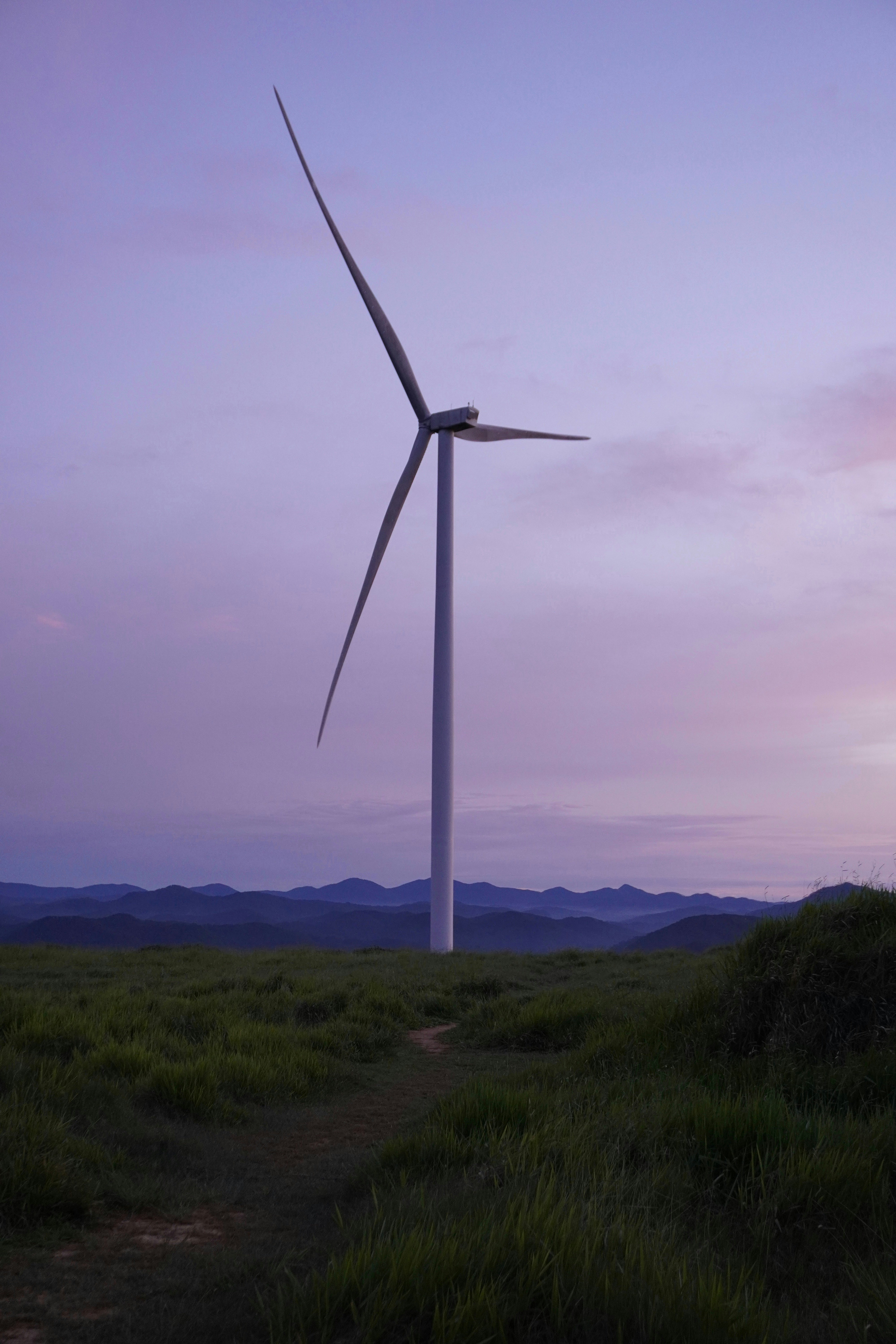 Wind Turbine at Dusk: A Quiet Pulse Over Open Fields