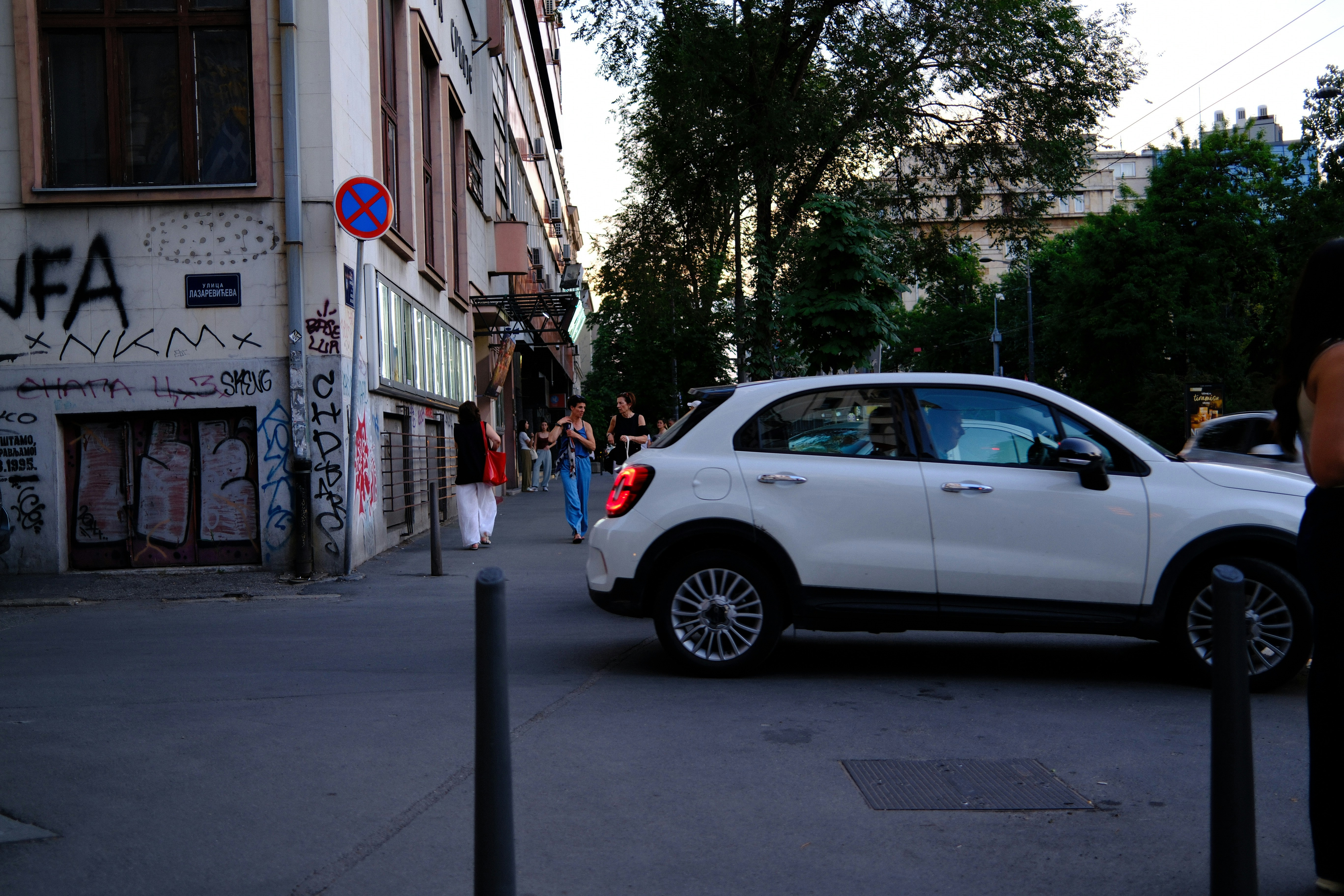 City Street Pulse: A White SUV at the Edge of the Frame