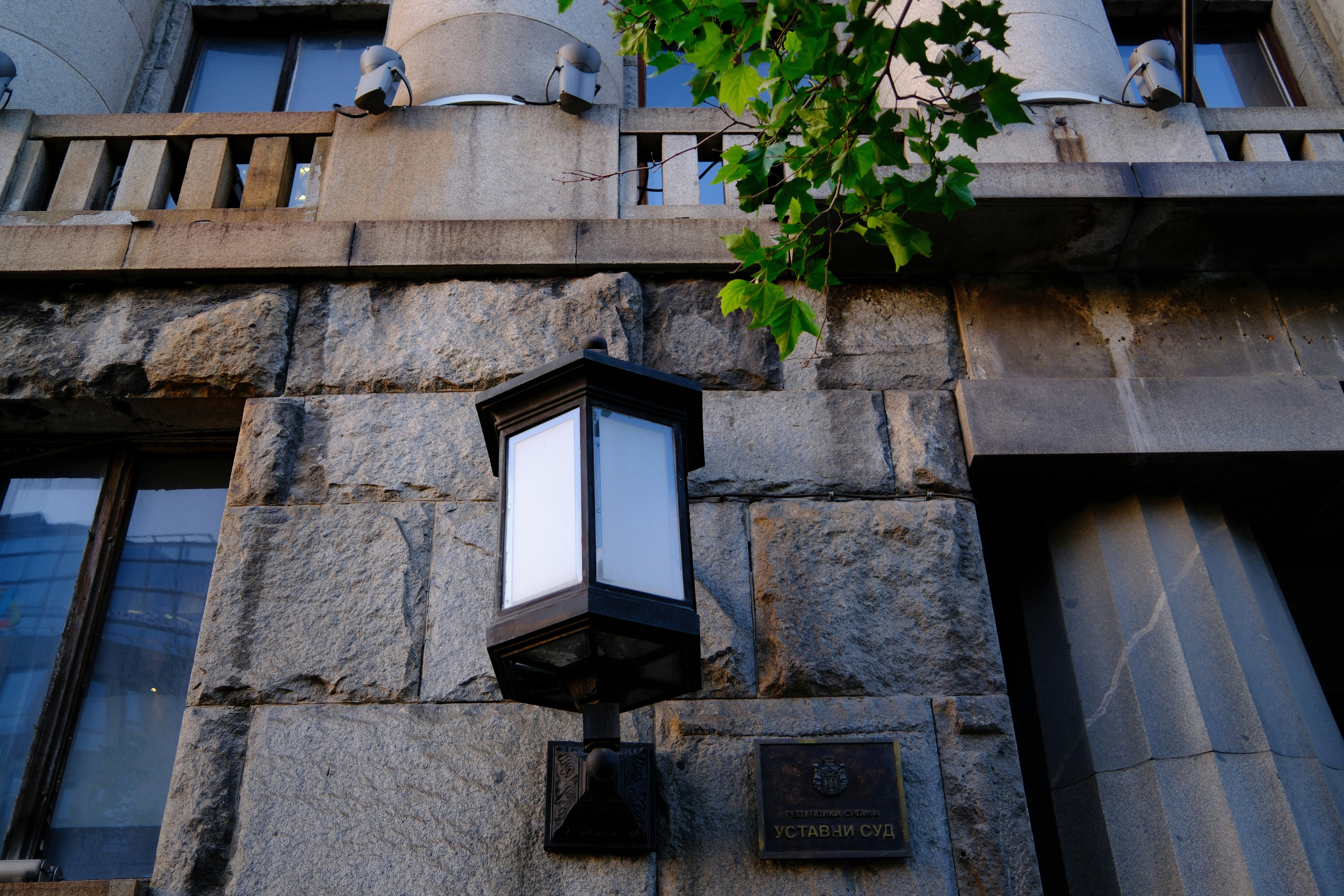 Lantern Beneath the Balcony: A Quiet Facade Study