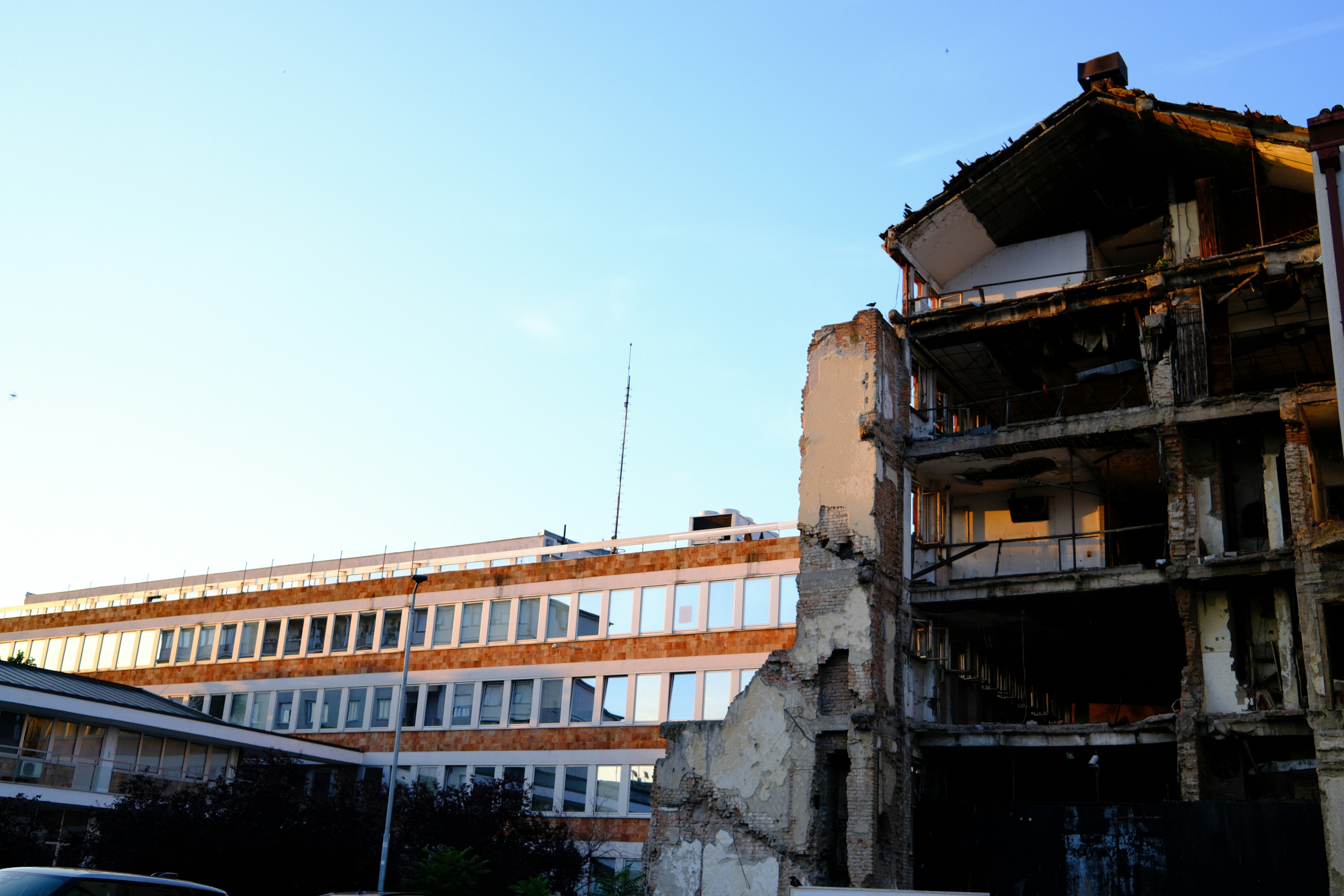 Rubble and Renewal: A City Edge Between Modern Glass and Timed Decay