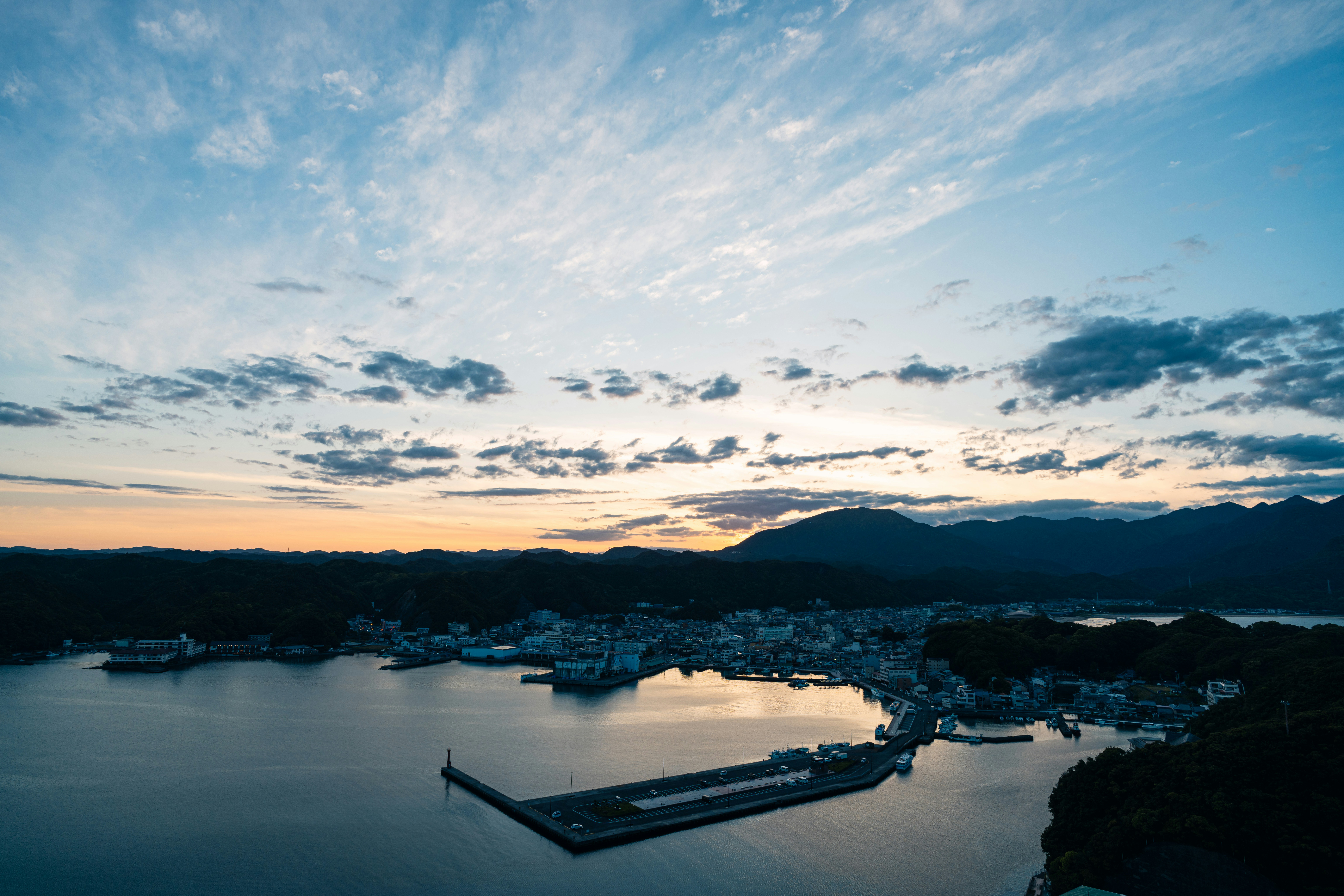 Dusk Over a Quiet Harbor: Boats Rest Below a Velvet Sky