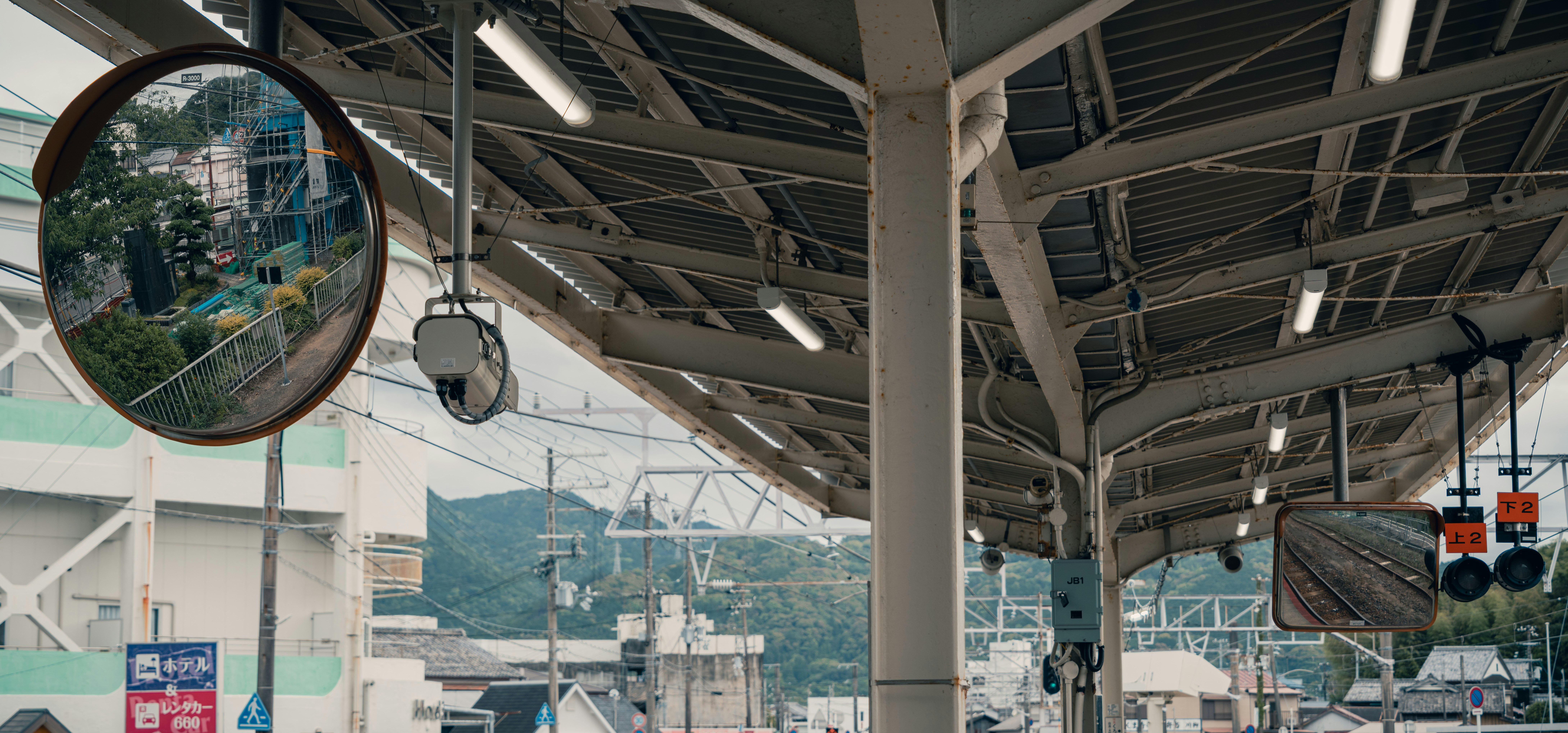 Transit Canopy Lines: A Quiet Urban Station Under Steel Skies