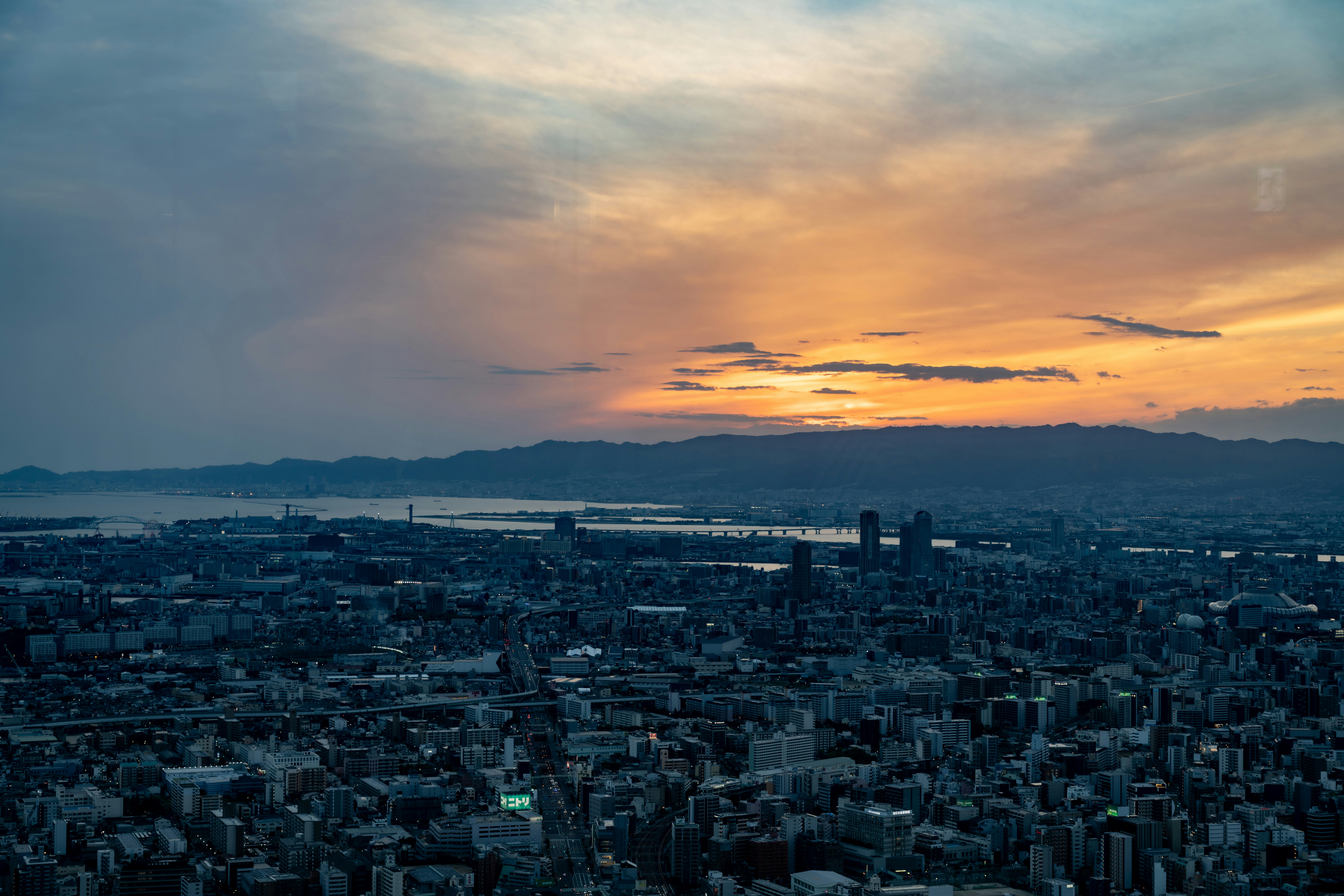 Dusk over the Urban Grid: City Lights Begin to Glimmer