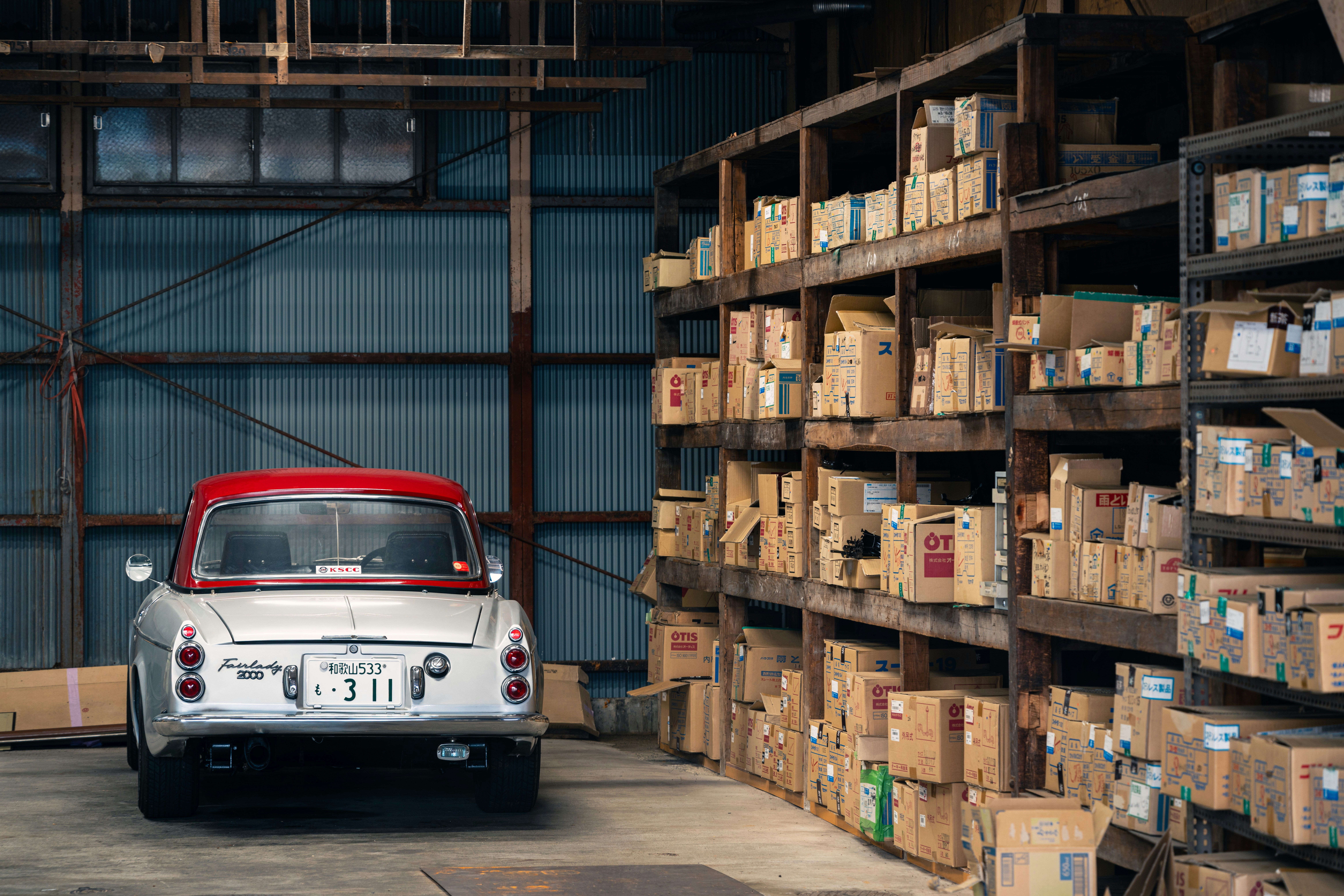 Retro Red Roofed Car in a Boxed Warehouse