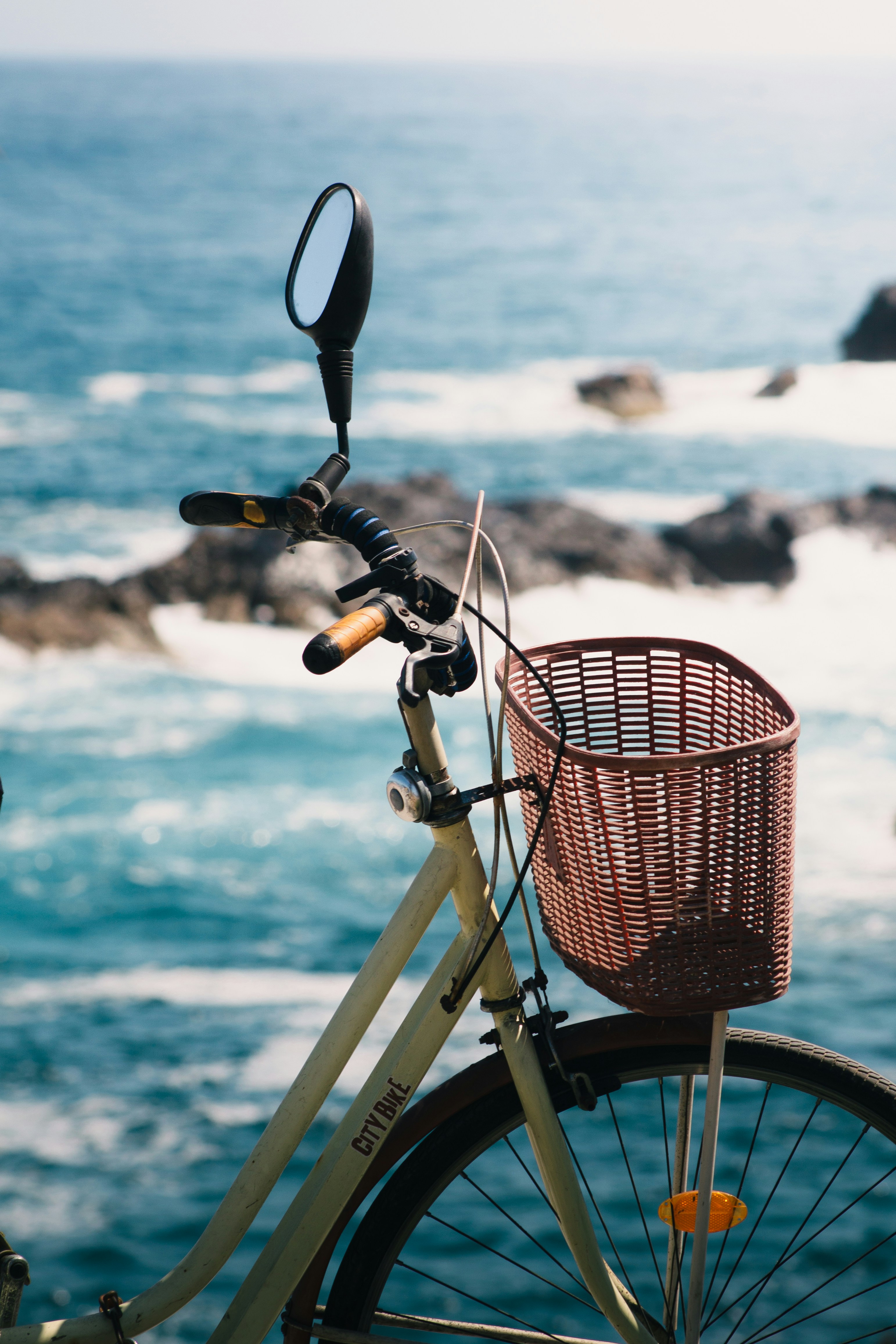 Pastel Ride by the Sea: A Bicycle Framing the Endless Blue