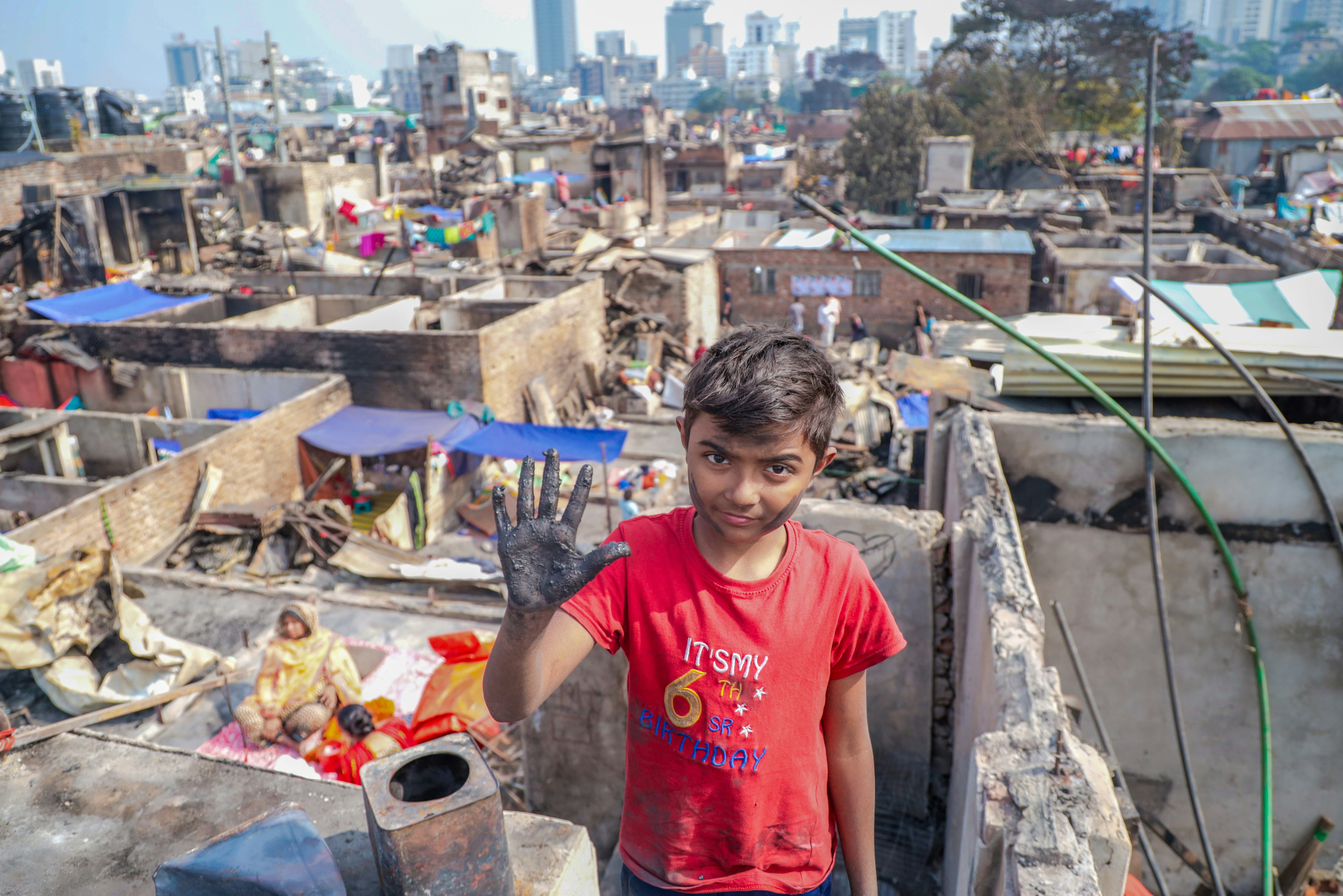 Raised Hand in a Rooftop Alley: A Gaze Toward Hope