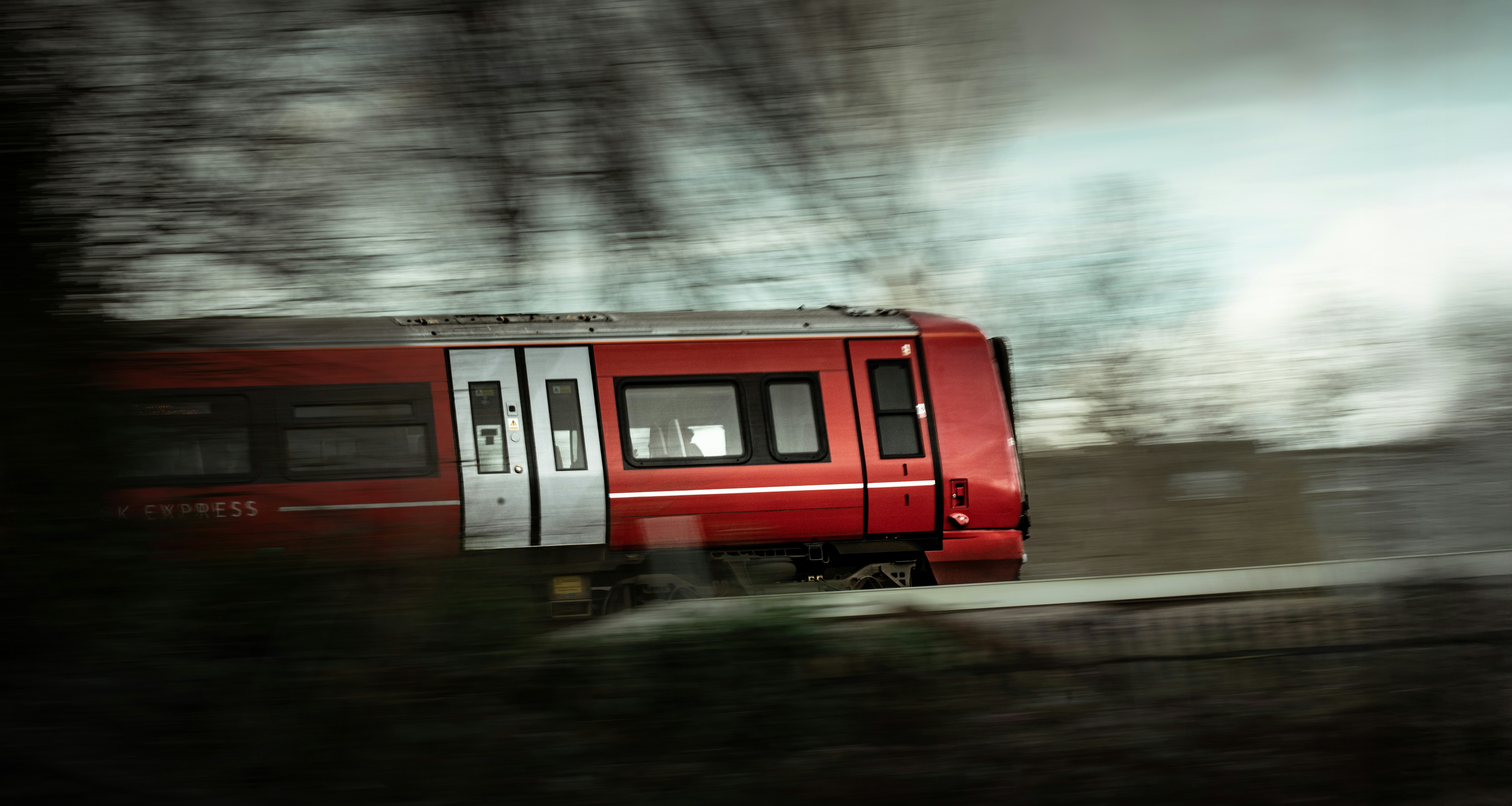 Red Train in Blur: A Moment of Transit Velocity