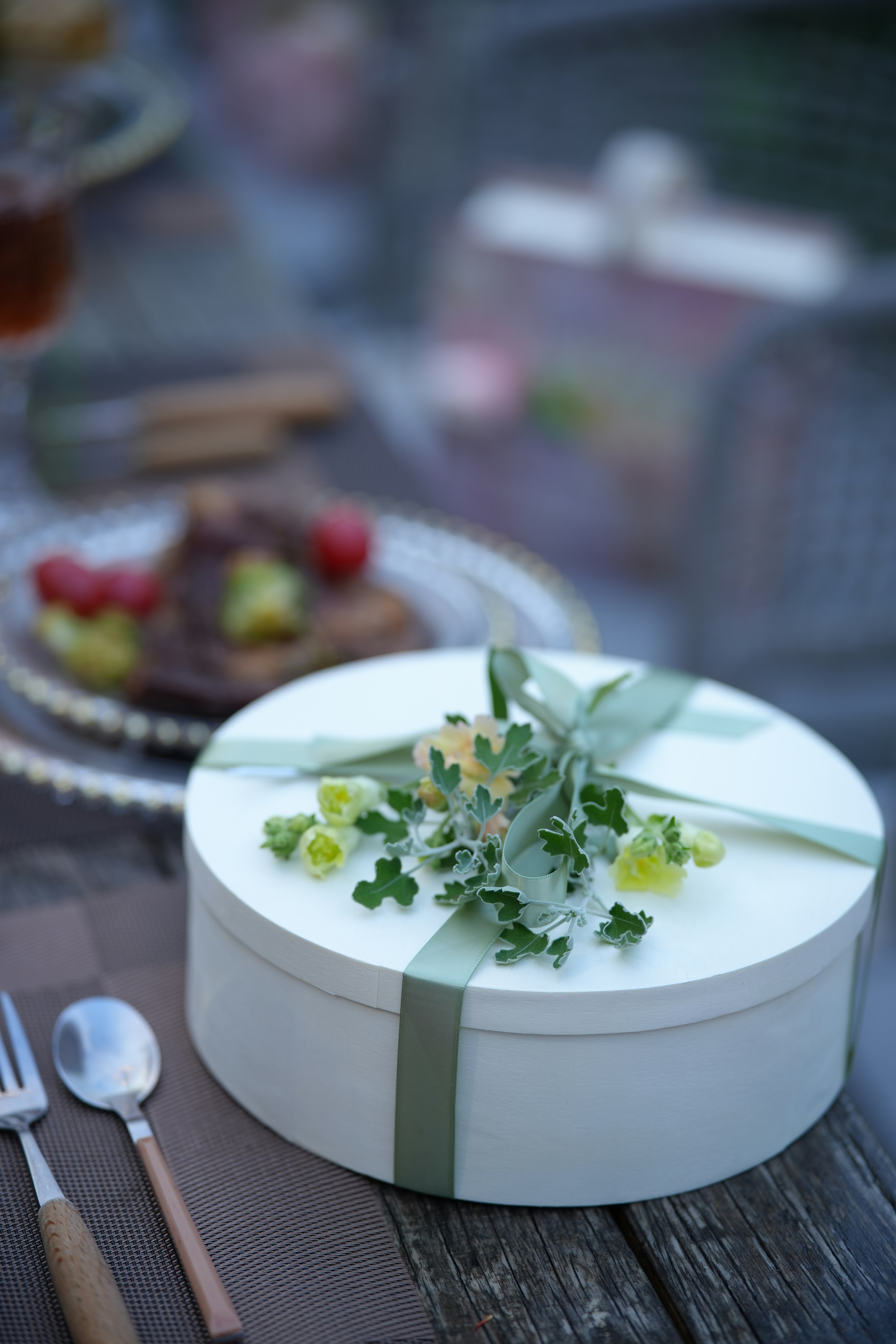 A Quiet Celebration: Delicate Bouquet on a Gift Box