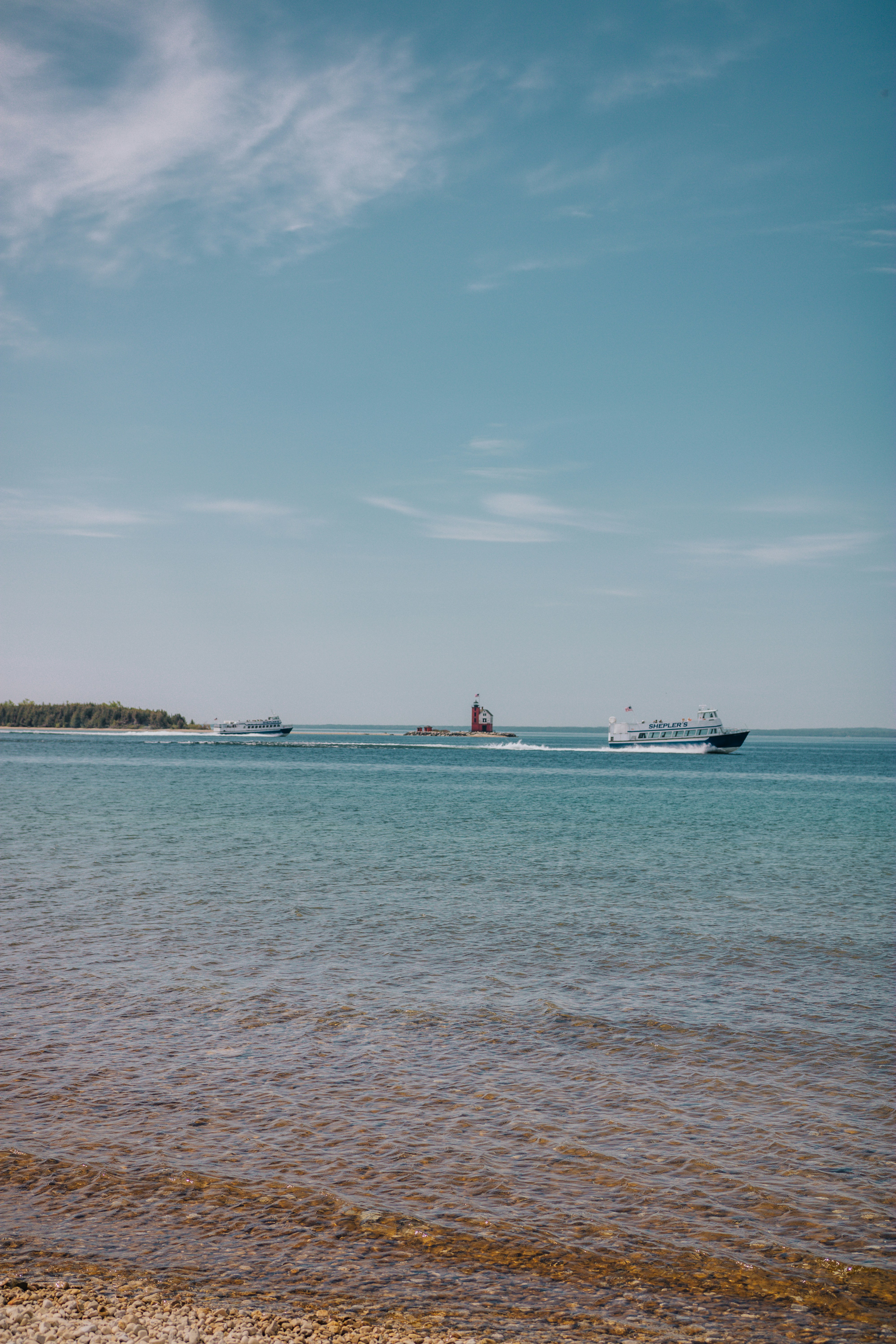 Two Boats Across a Calm Coastal Horizon
