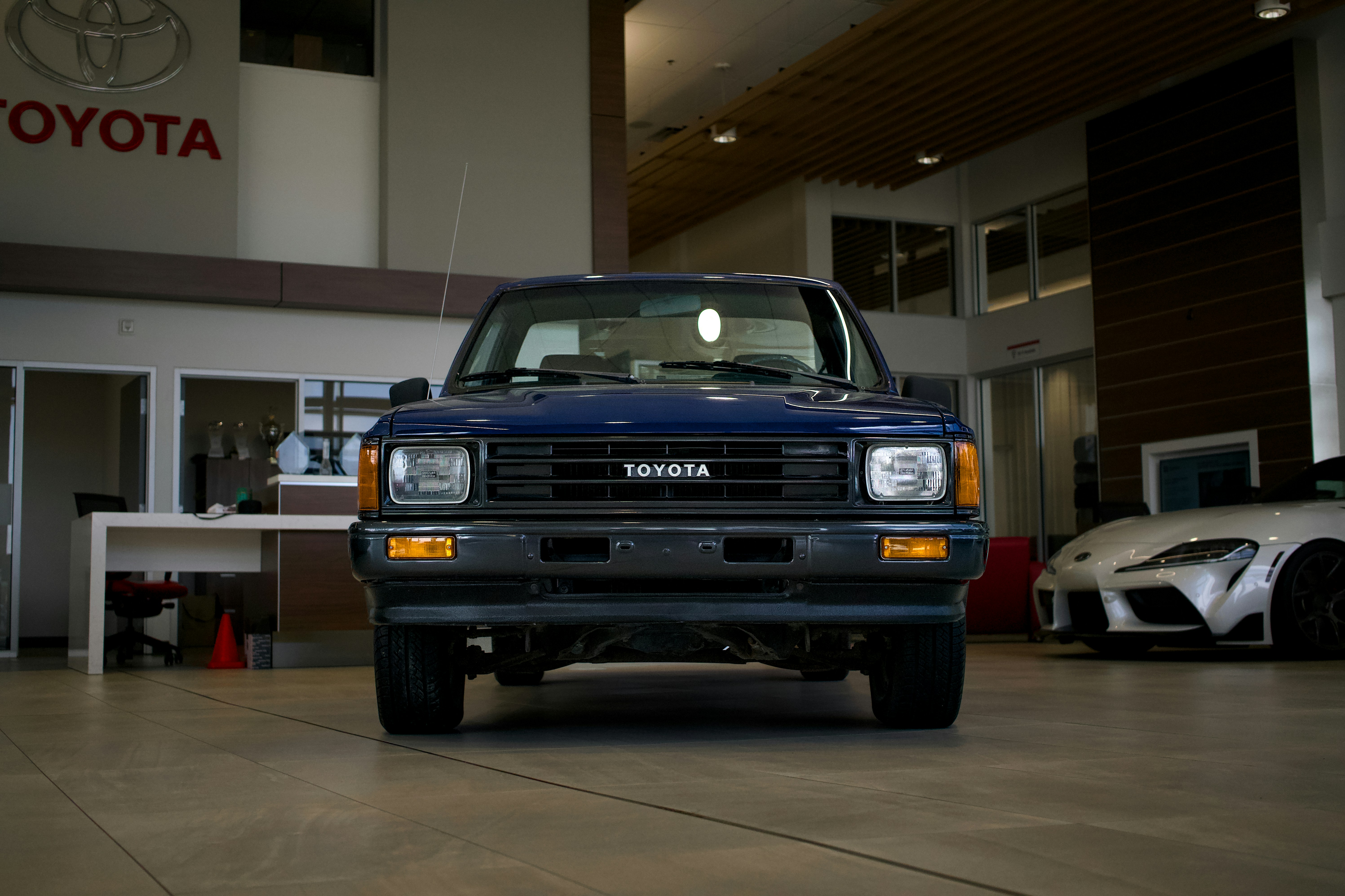 Front-and-Coy: A Navy Toyota Pickup Under showroom Lights