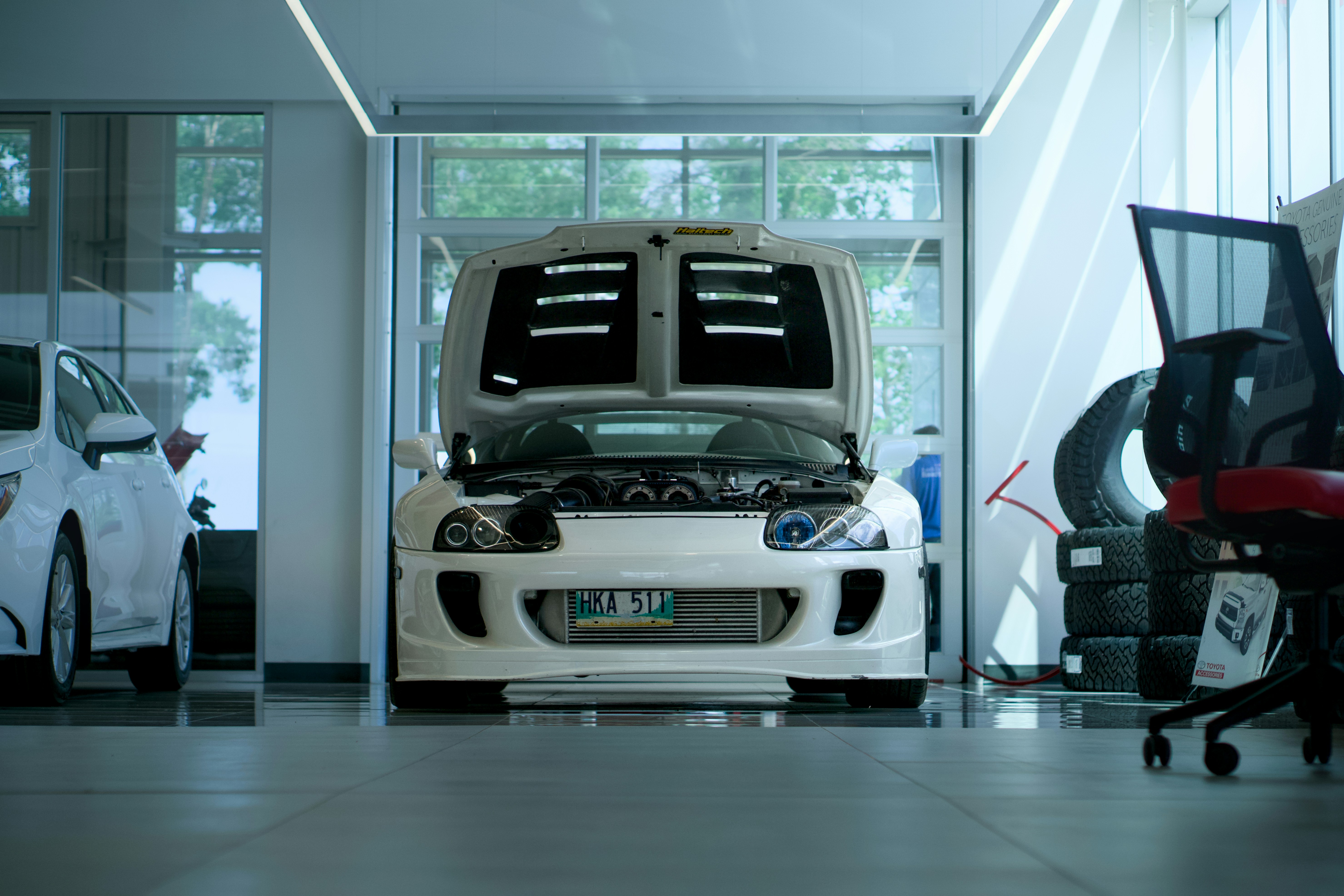 Centerstage Vented: A White Performance Car Under Studio Lights