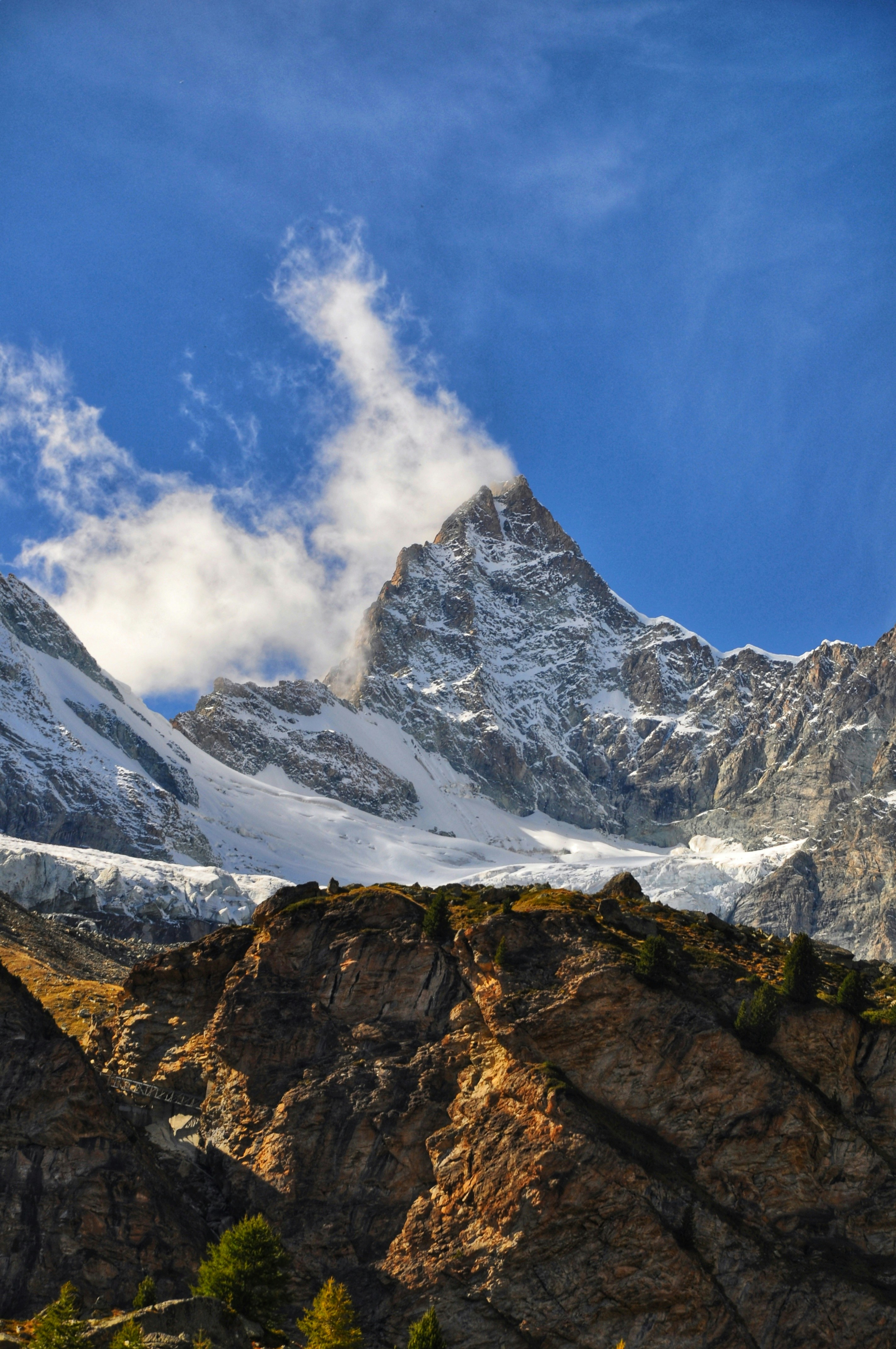 Snow-crowned Peak Piercing a Clear Blue Sky