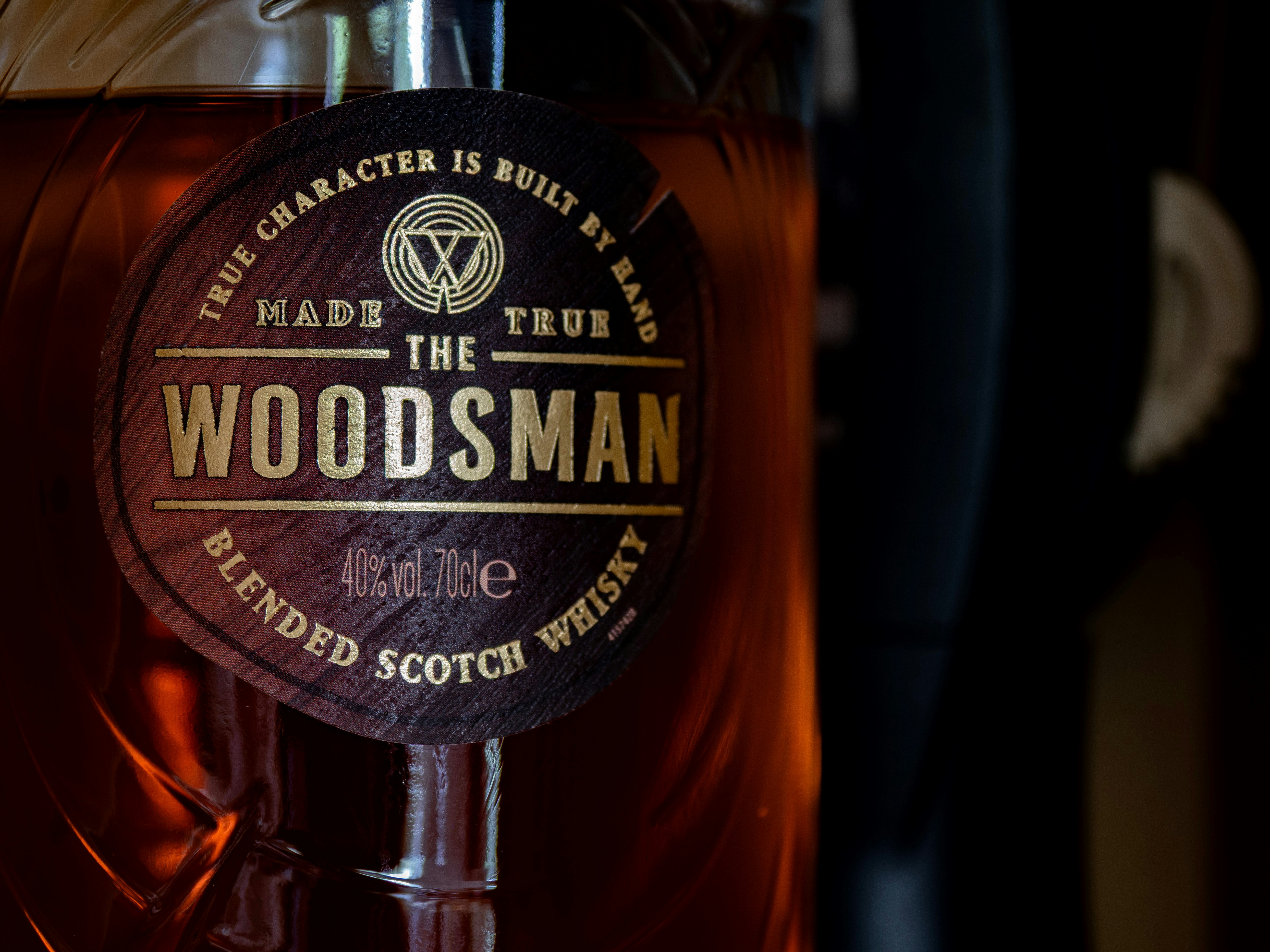 glass, close up, bokeh, blurred background, wood, whisky glass, gibraltar glass, woodsman, blended whisky, whisky, scotch whisky,
