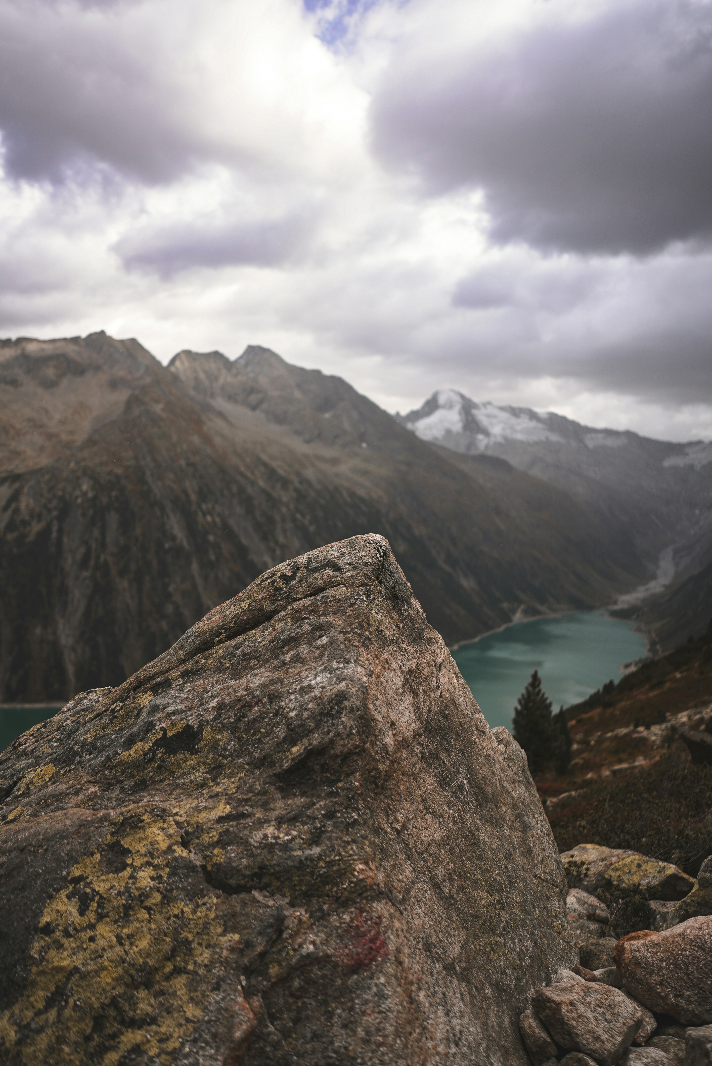 Stone Sentinel Overlooking a Glacier-Threaded Valley