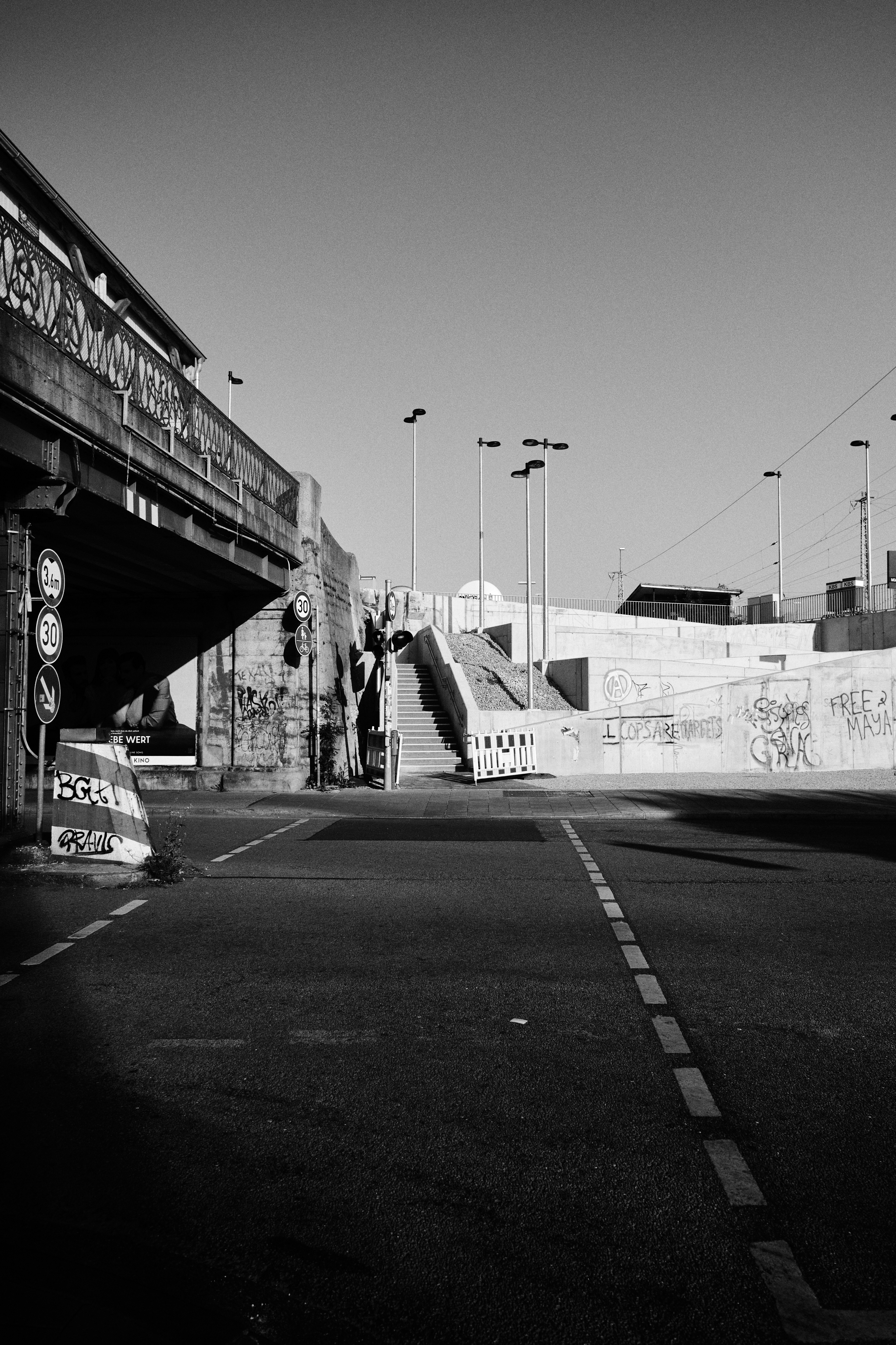 Urban Underpass Stairs: Graffiti, Shadows, and Staccato Light