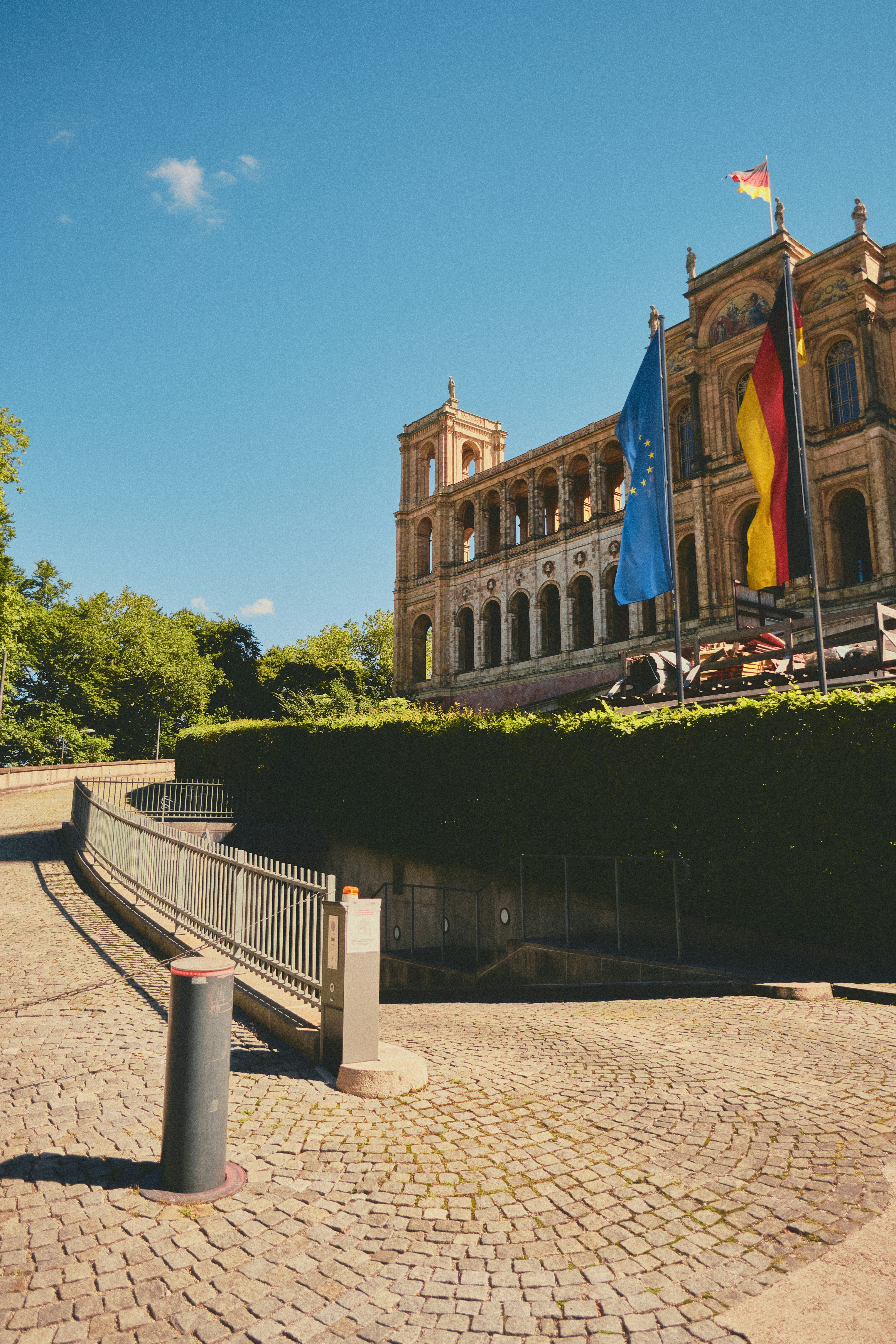 Flags and façade: a sunlit triumph over cobblestones