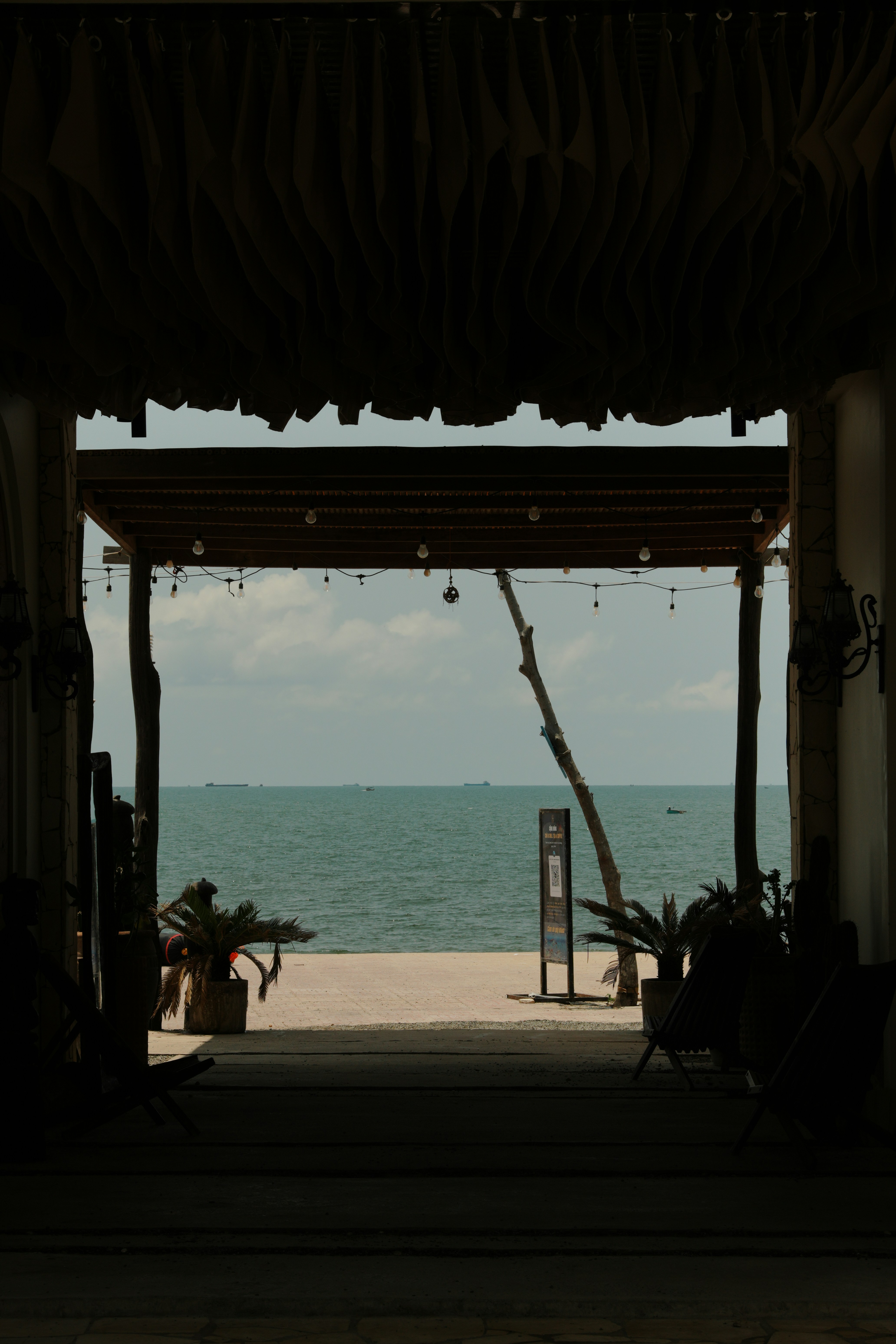 Framed Ocean Light Through a Sea-Front Archway