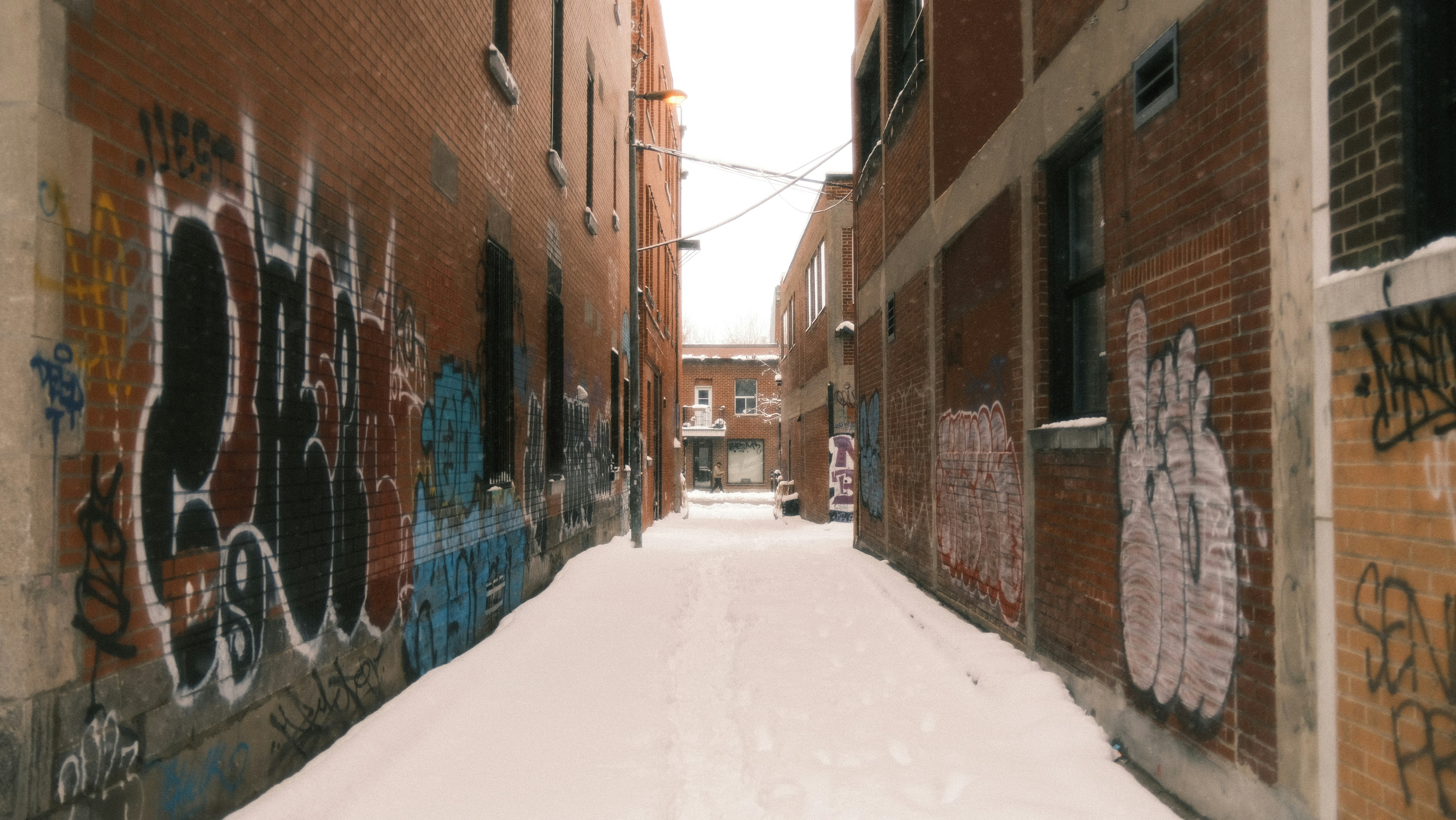 Snow-Quiet Alley: Graffiti Walls and Winter Silence