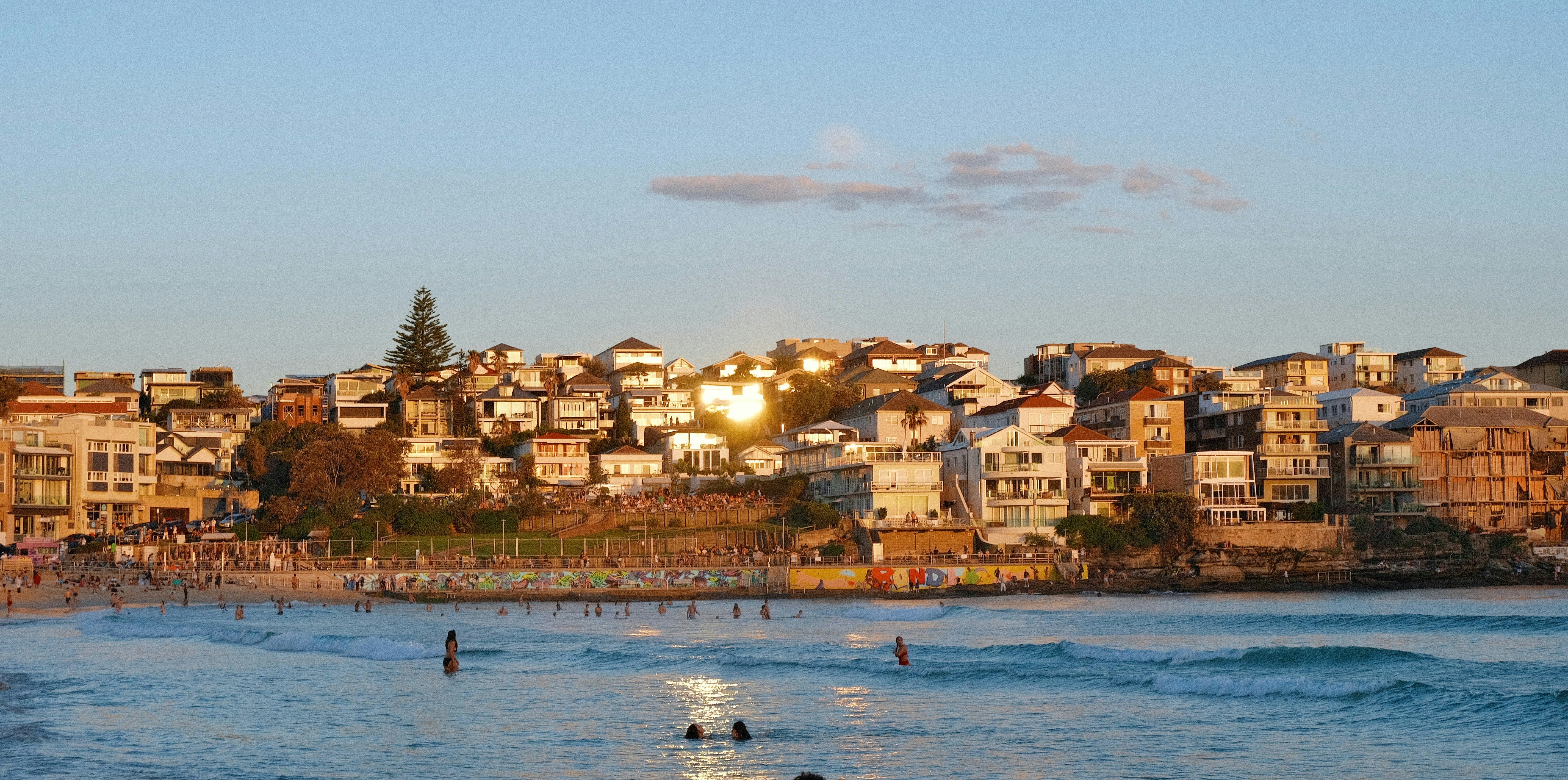 Sunlit Clifftop Homes: Coastal Town with a Glinting Moment