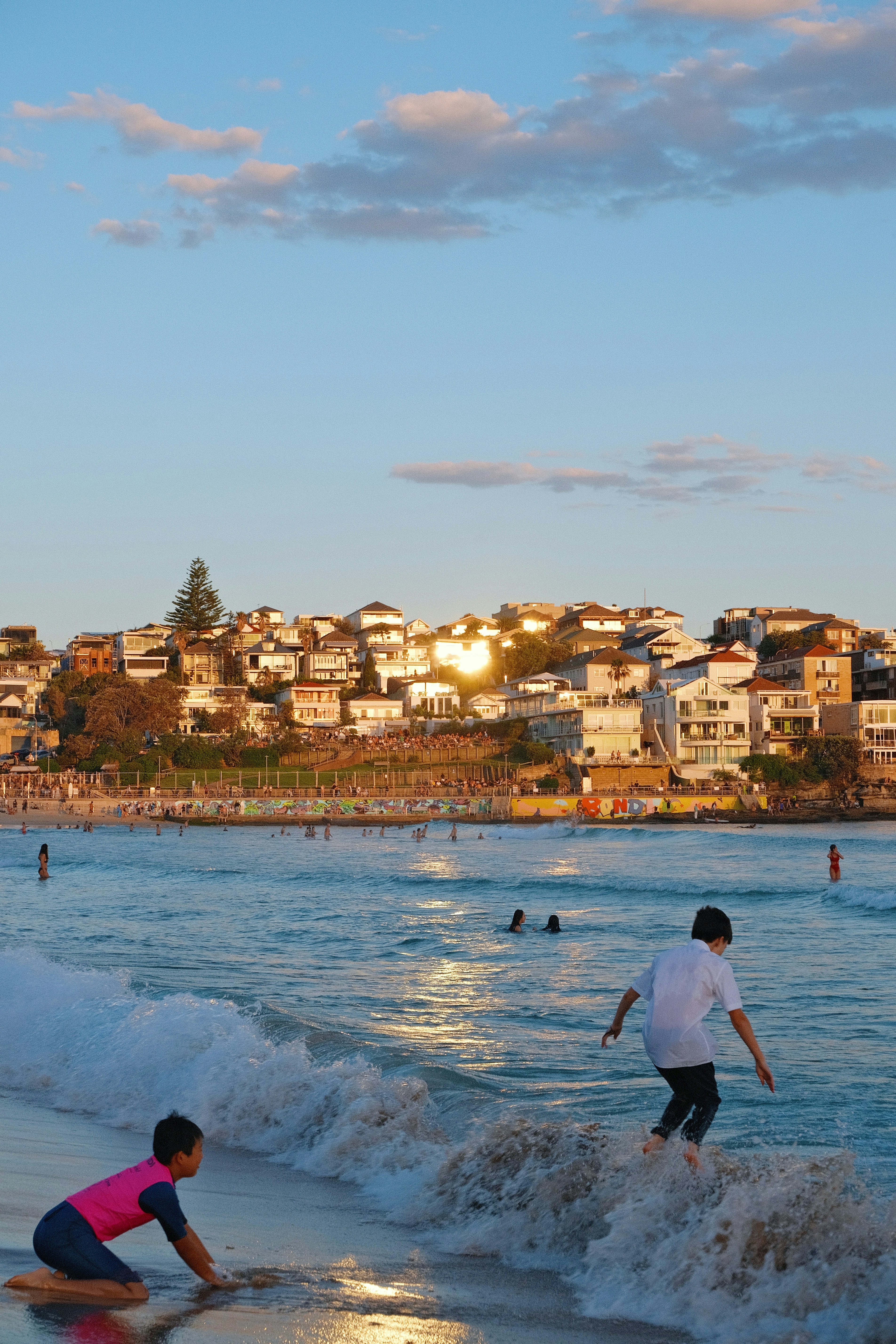 Sunlit Seaside Chorus: Kids at Play as a Coastal Town Glows
