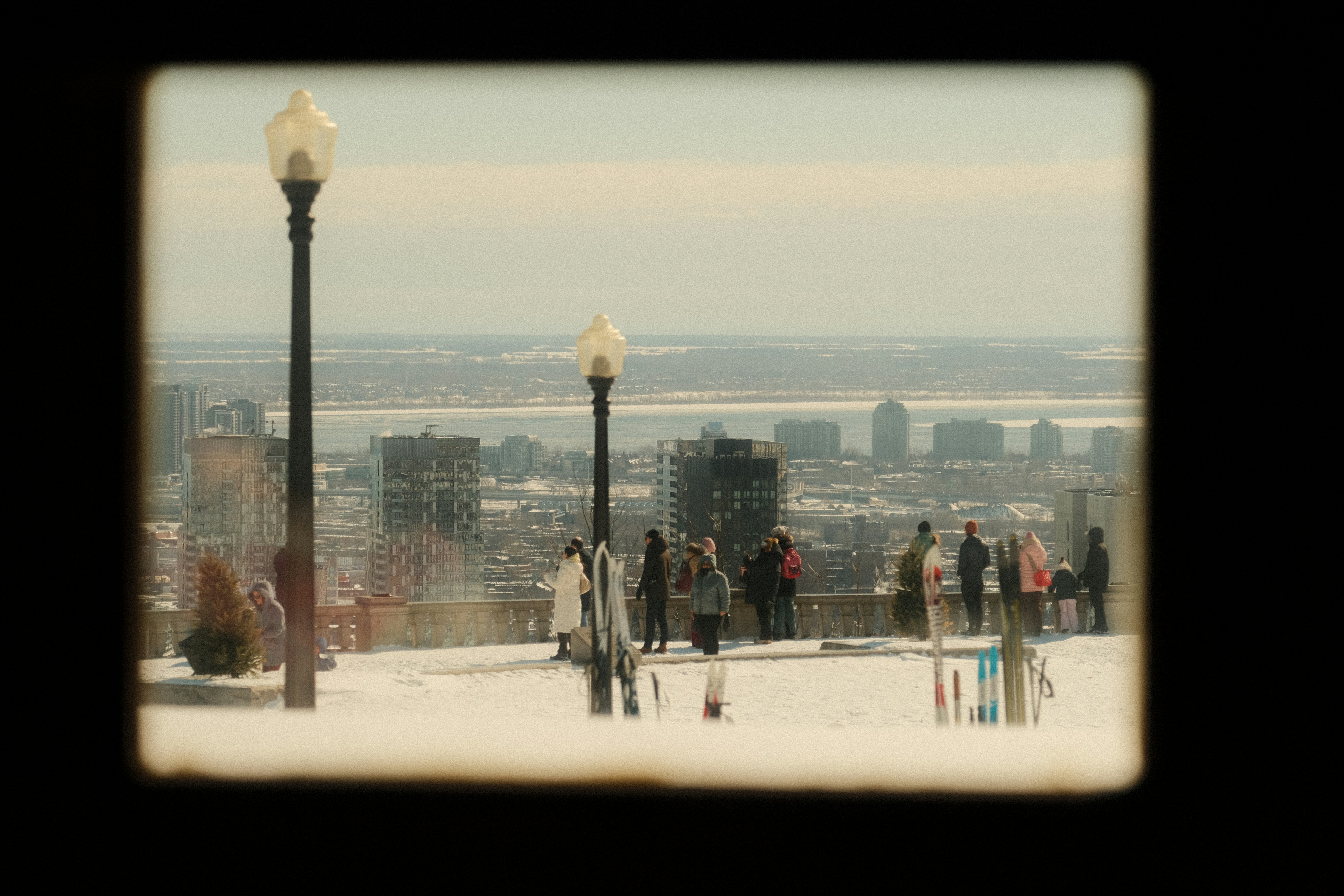 Snowy overlook: cityscape framing through a vintage window