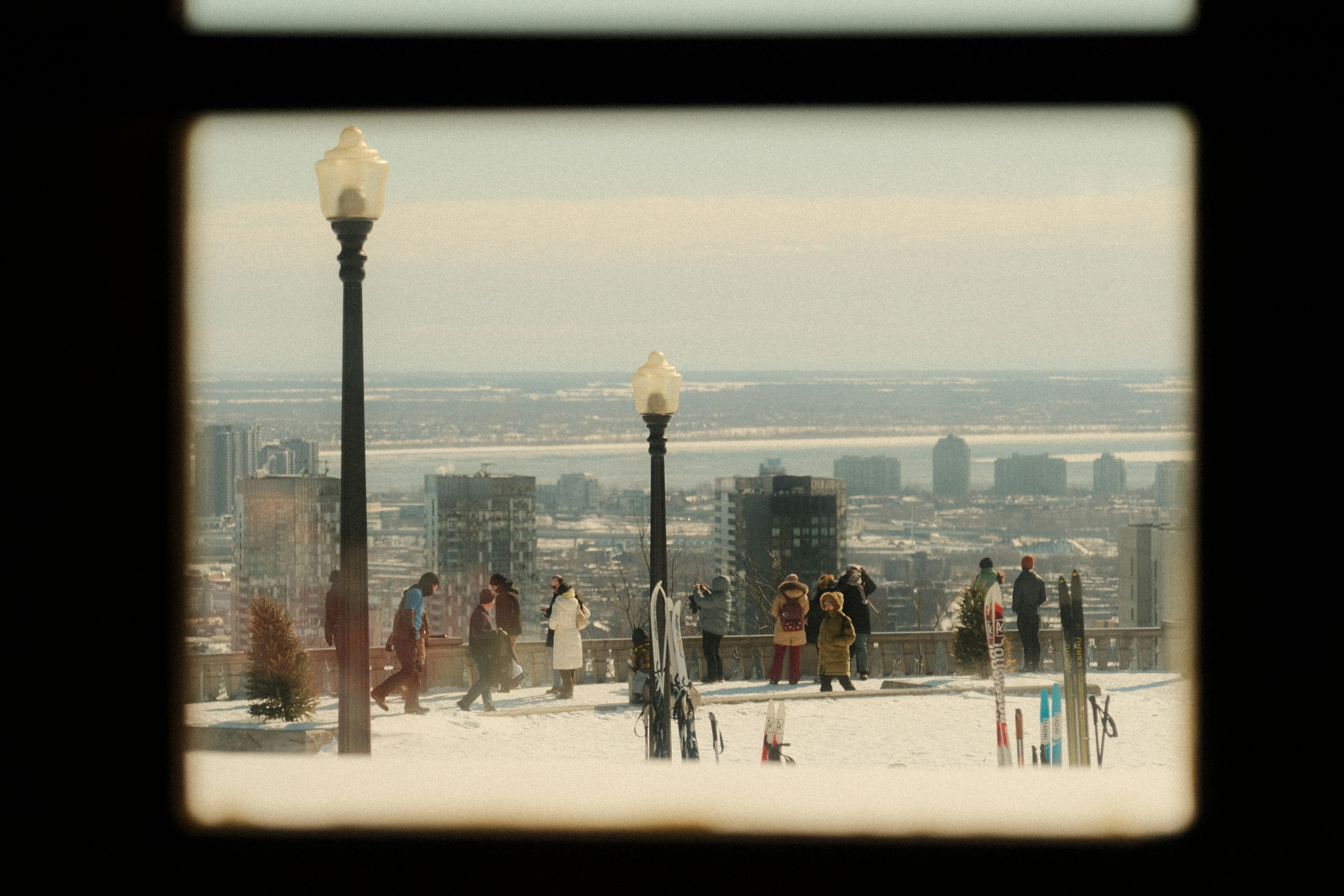 Winter Terrace: People in a Snowy City Overlook