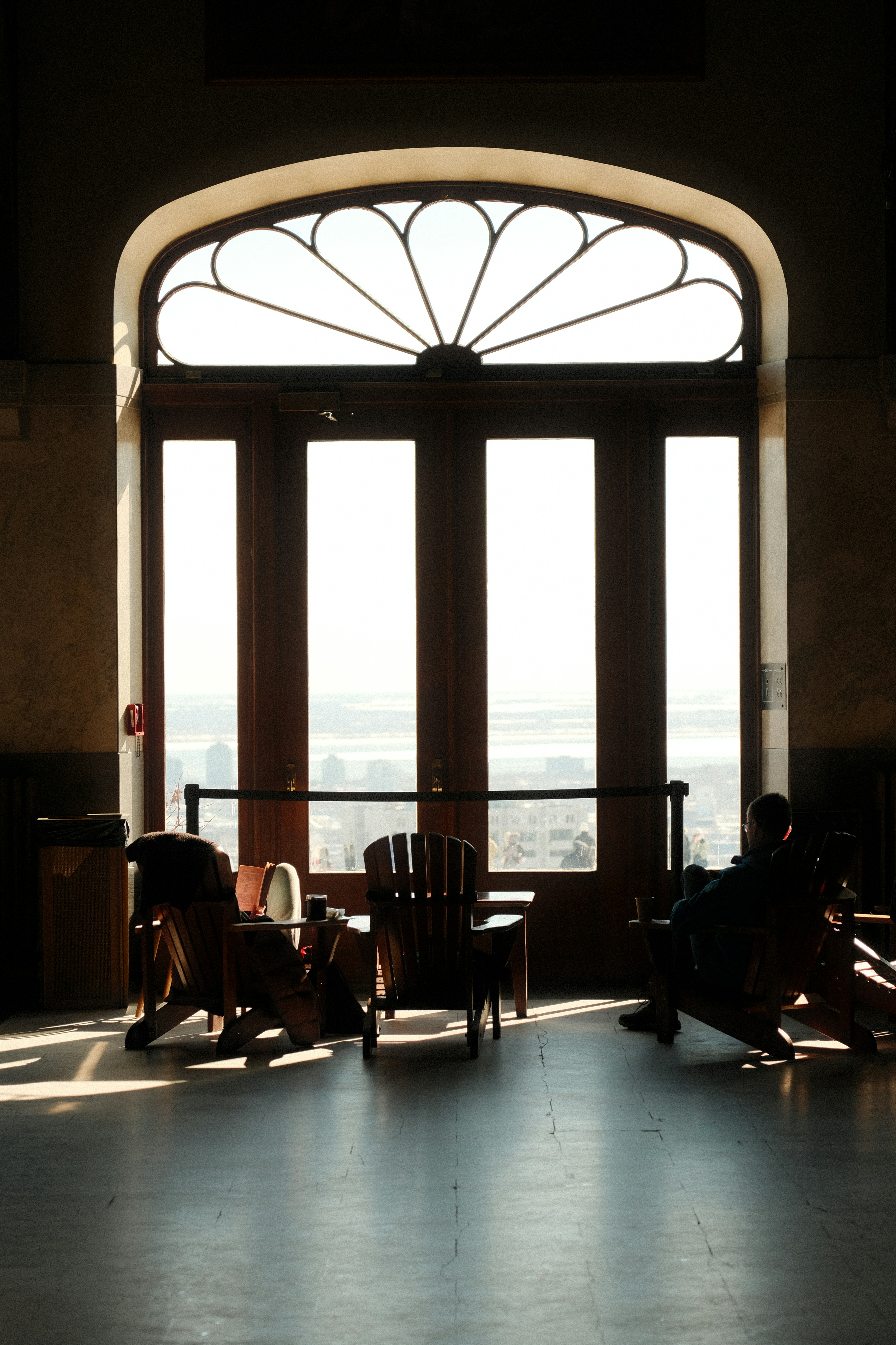 Sunlit Silence: Viewers Beneath the Arch