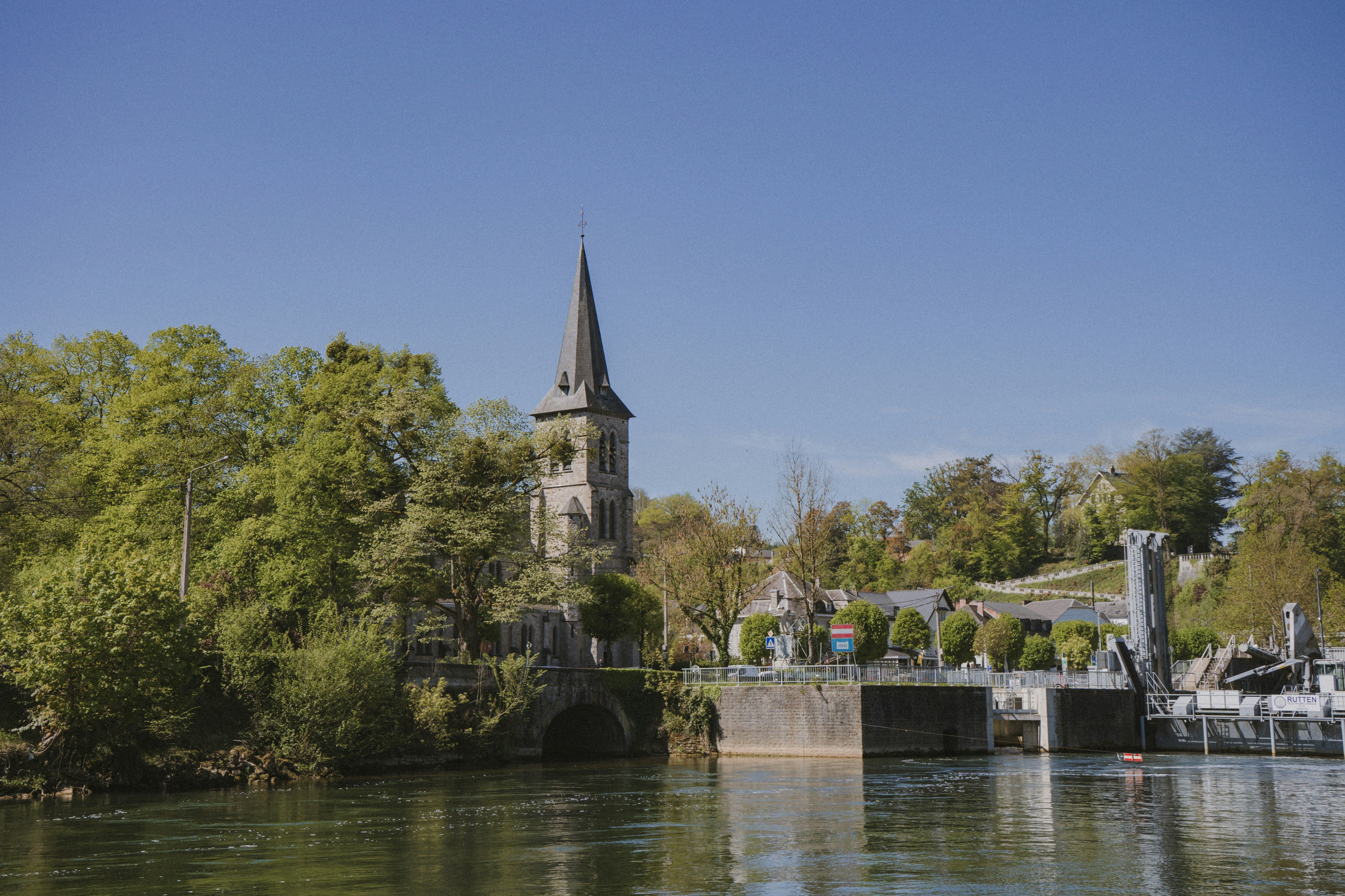 Riverside Clocktower: Morning Light on the European Bridge