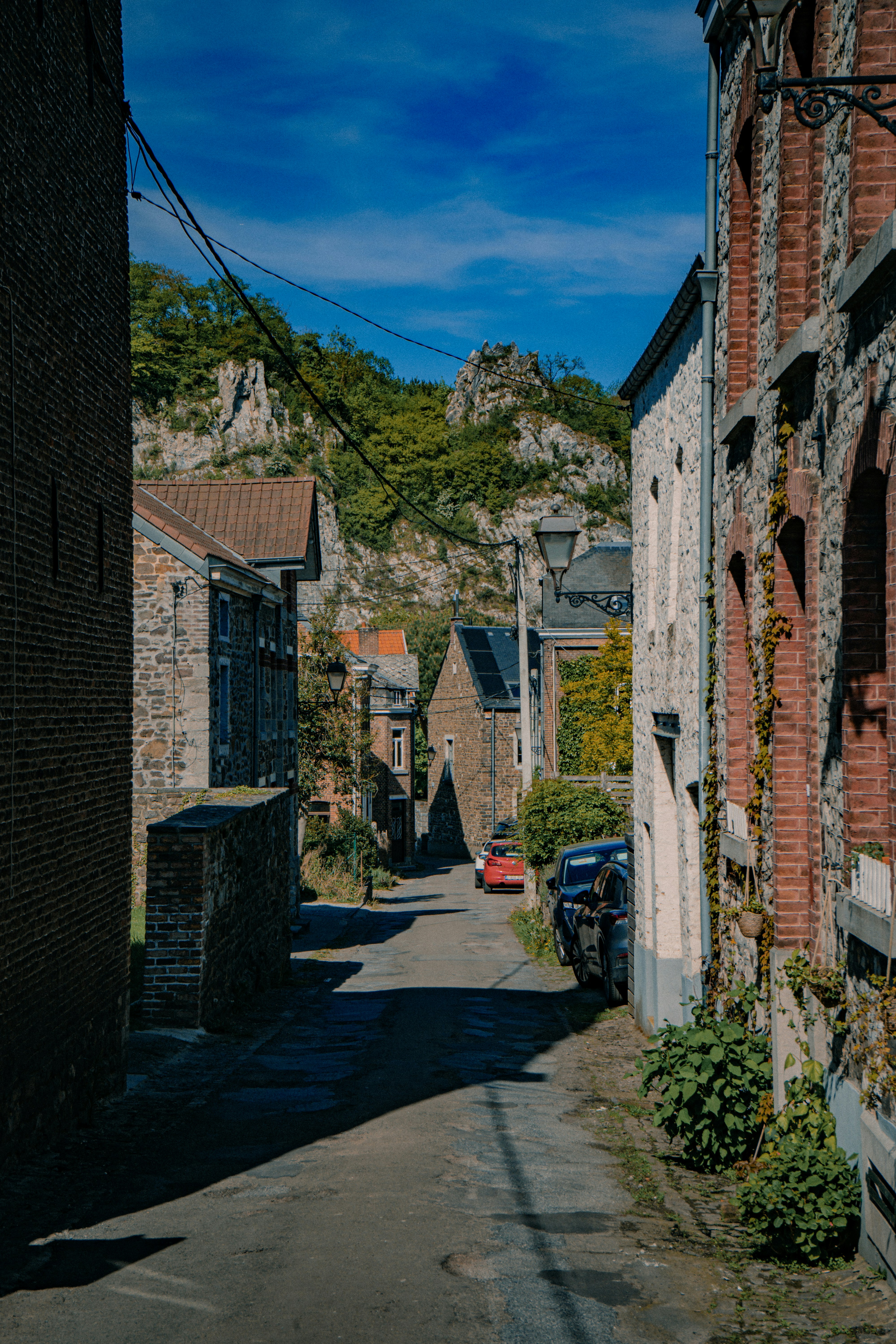 Sunlit Alleyway Through a European Village