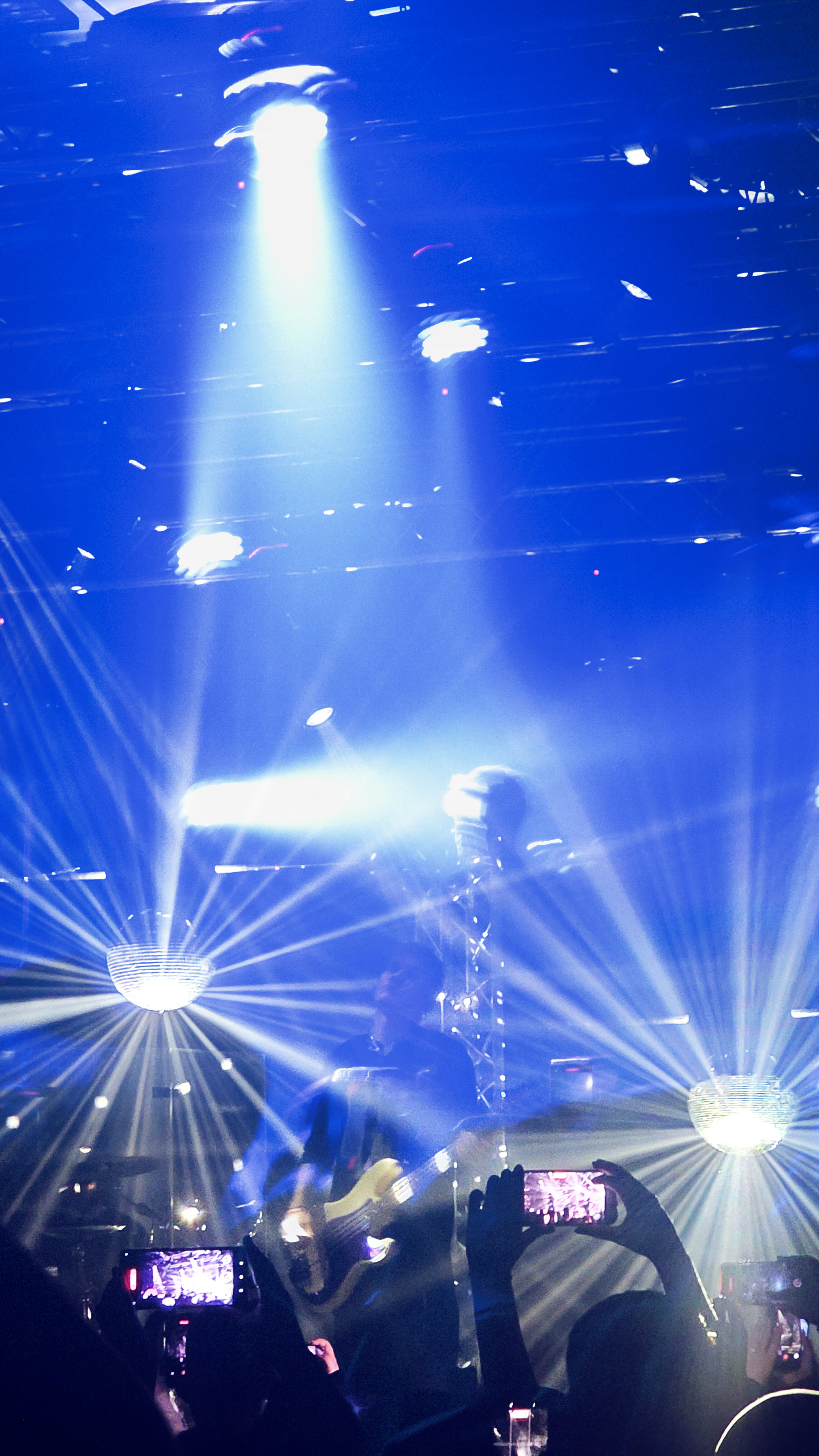Spotlight Pulse: A Live Chorus Under Blue Brilliance