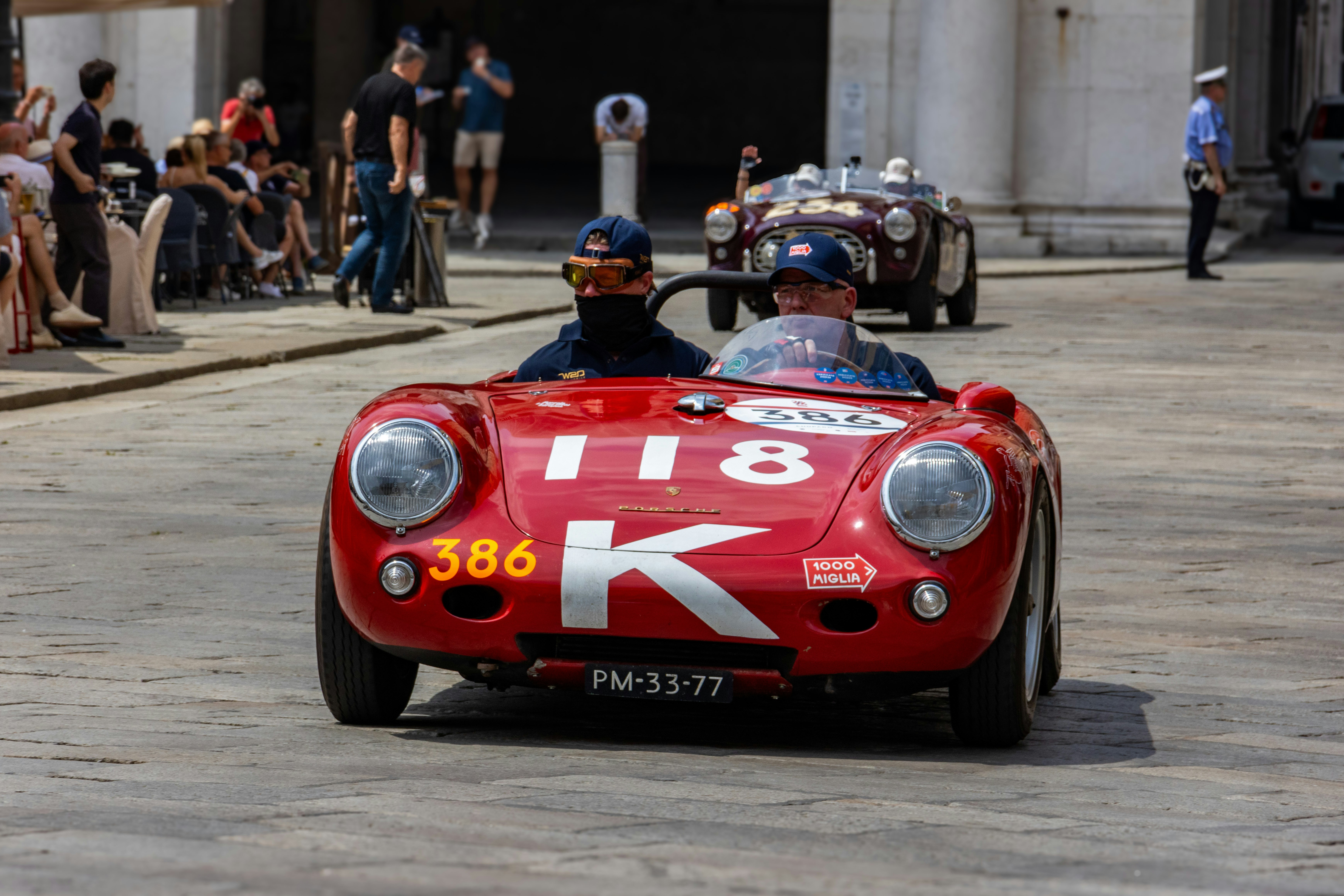 Red Racing Glory: Vintage Cabriolet in the City Parade