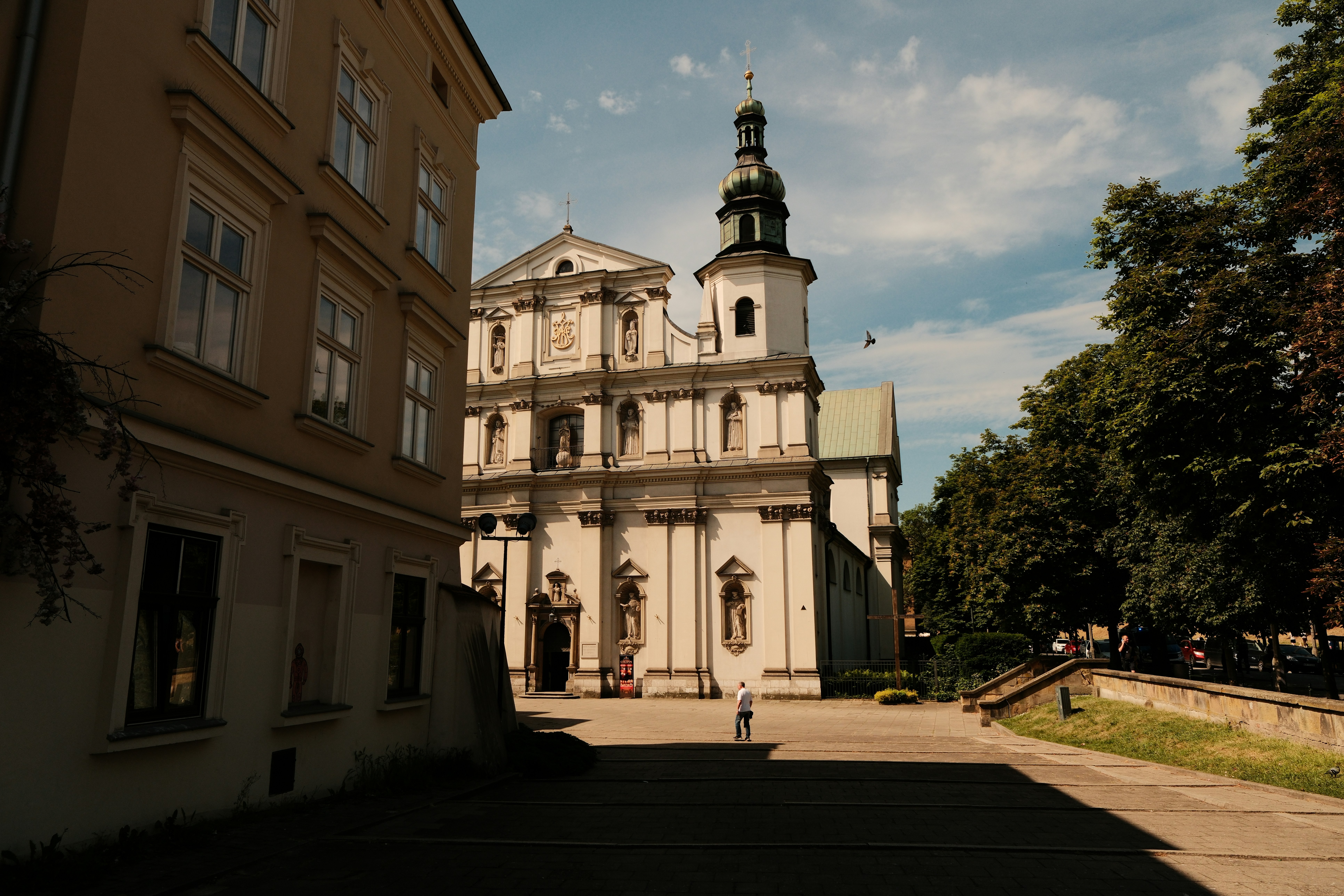 Ornate european church with a steeple on a sunny day.