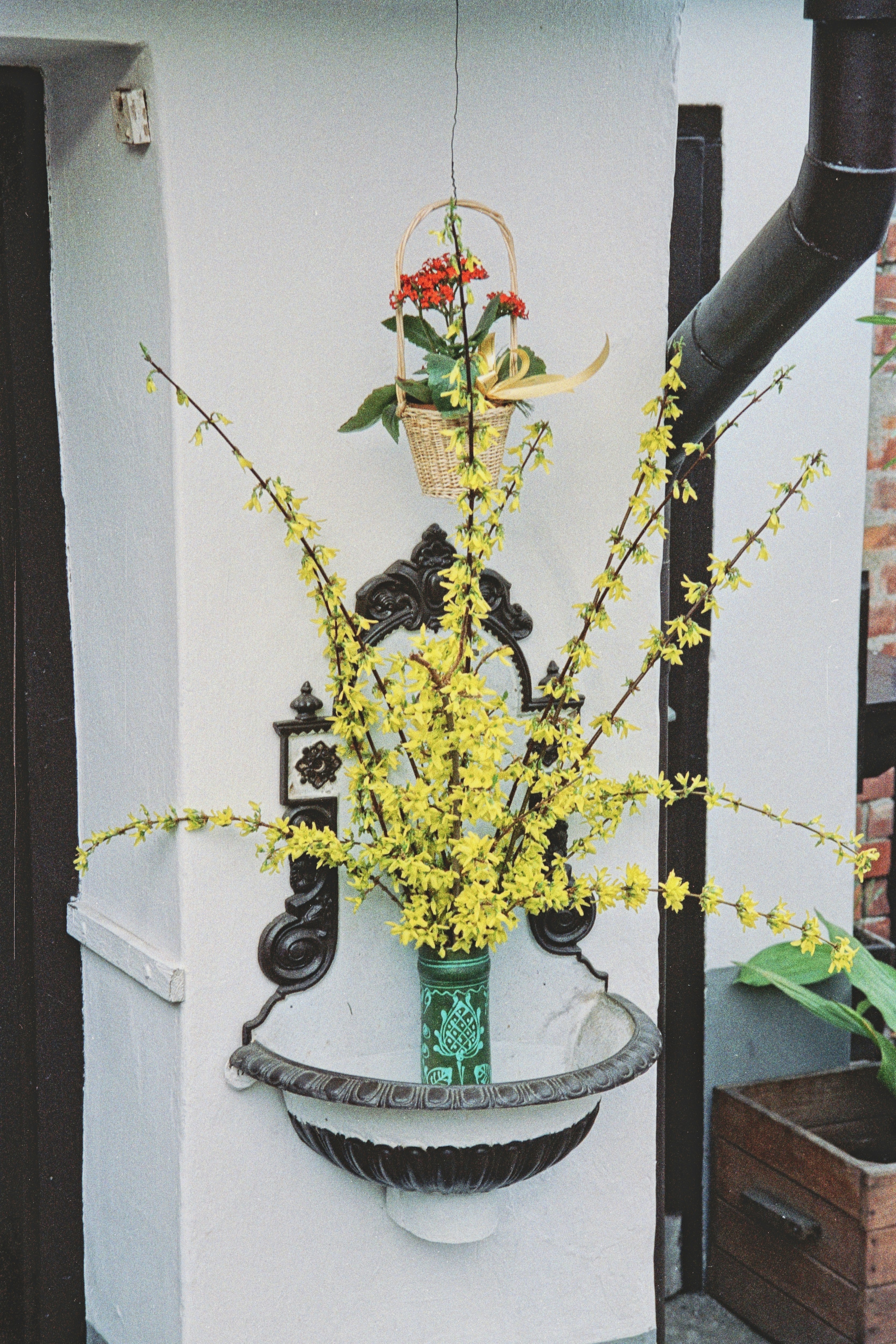 Yellow Chrysanthemum Bouquet in a Green Vase on a Vintage Spout