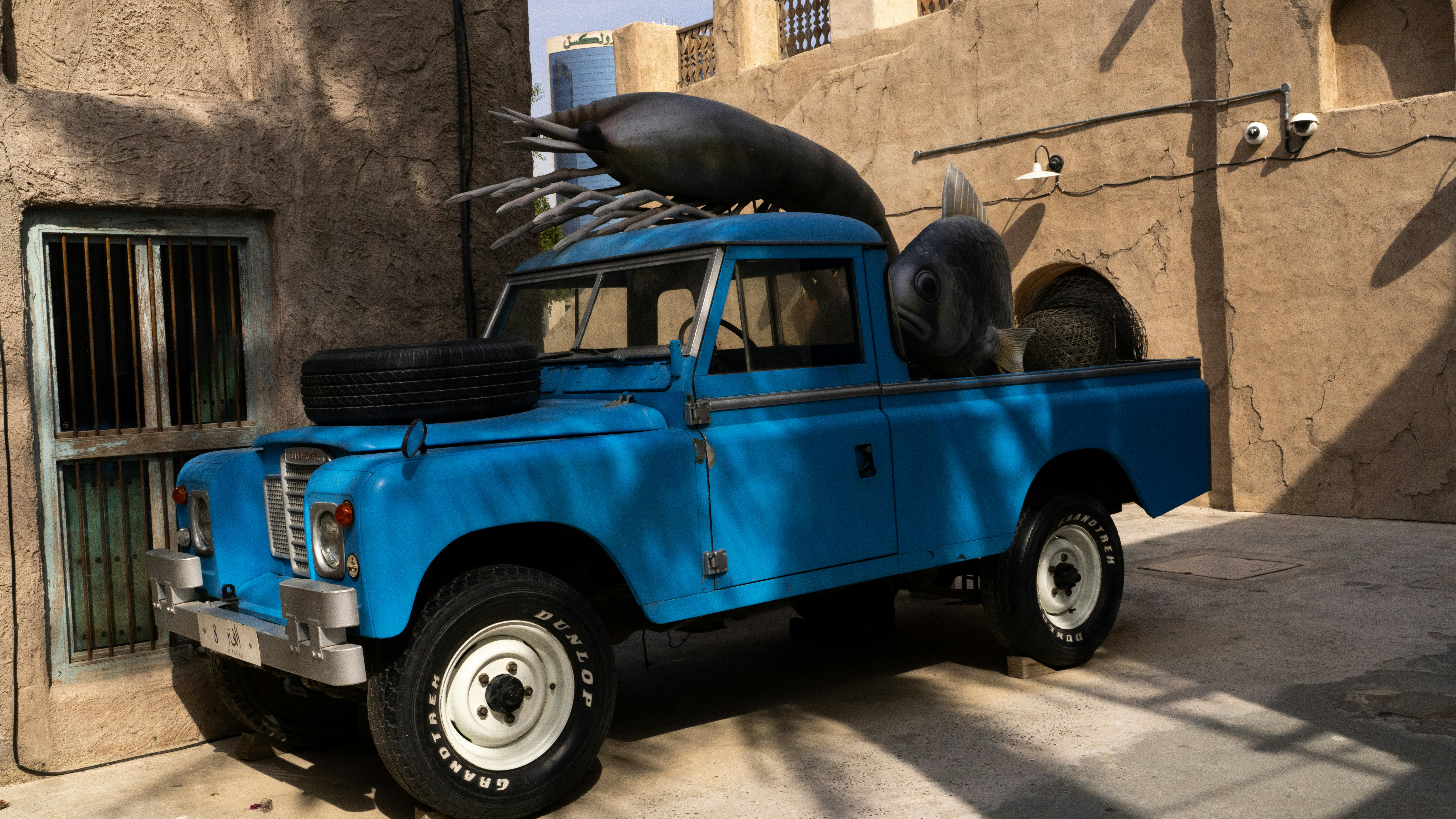 Blue Vintage Truck with Serene Sea Lion on Top