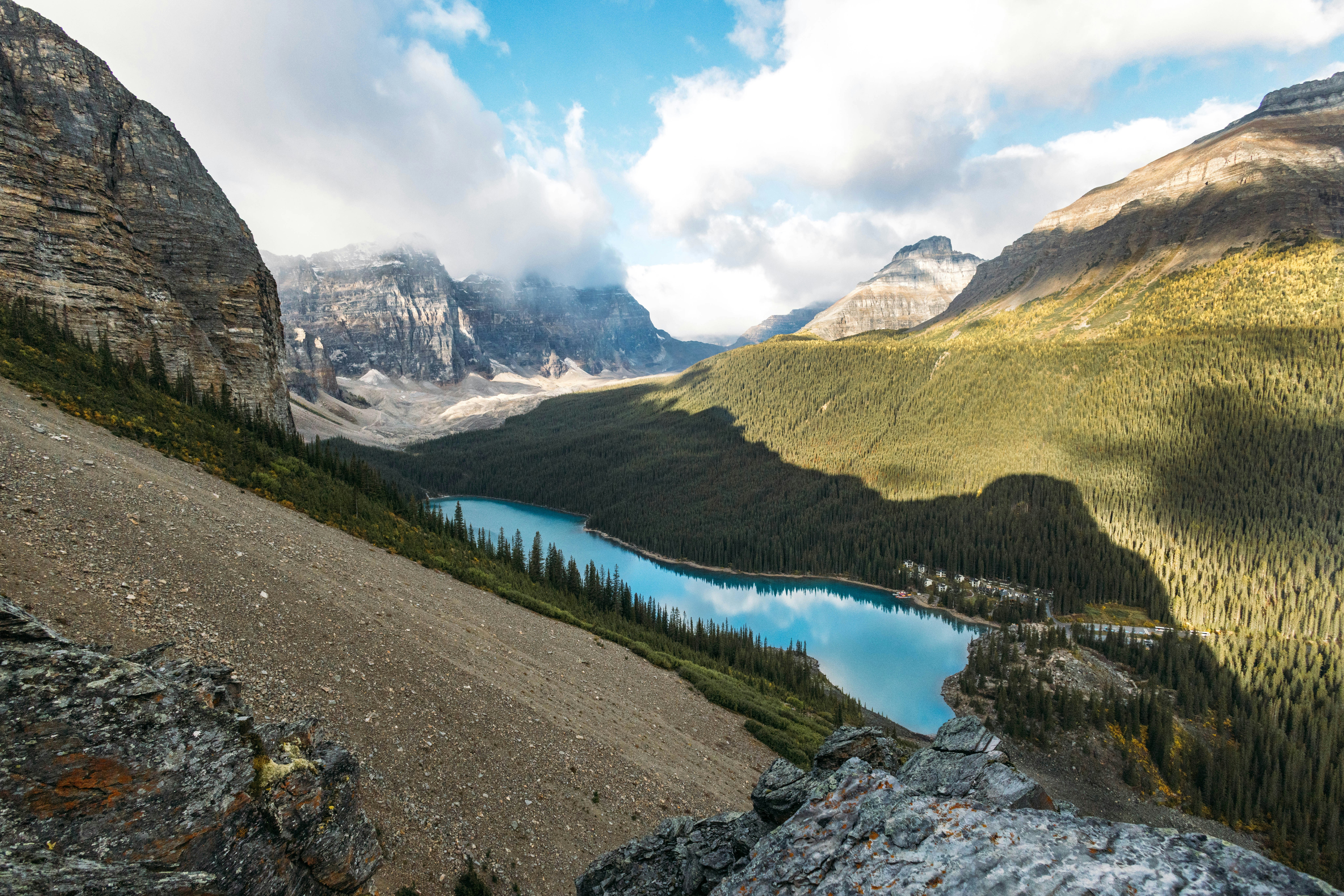 Azure Ribbon in the Valley: A Glacier-Blue Lake Framed by Majestic Peaks