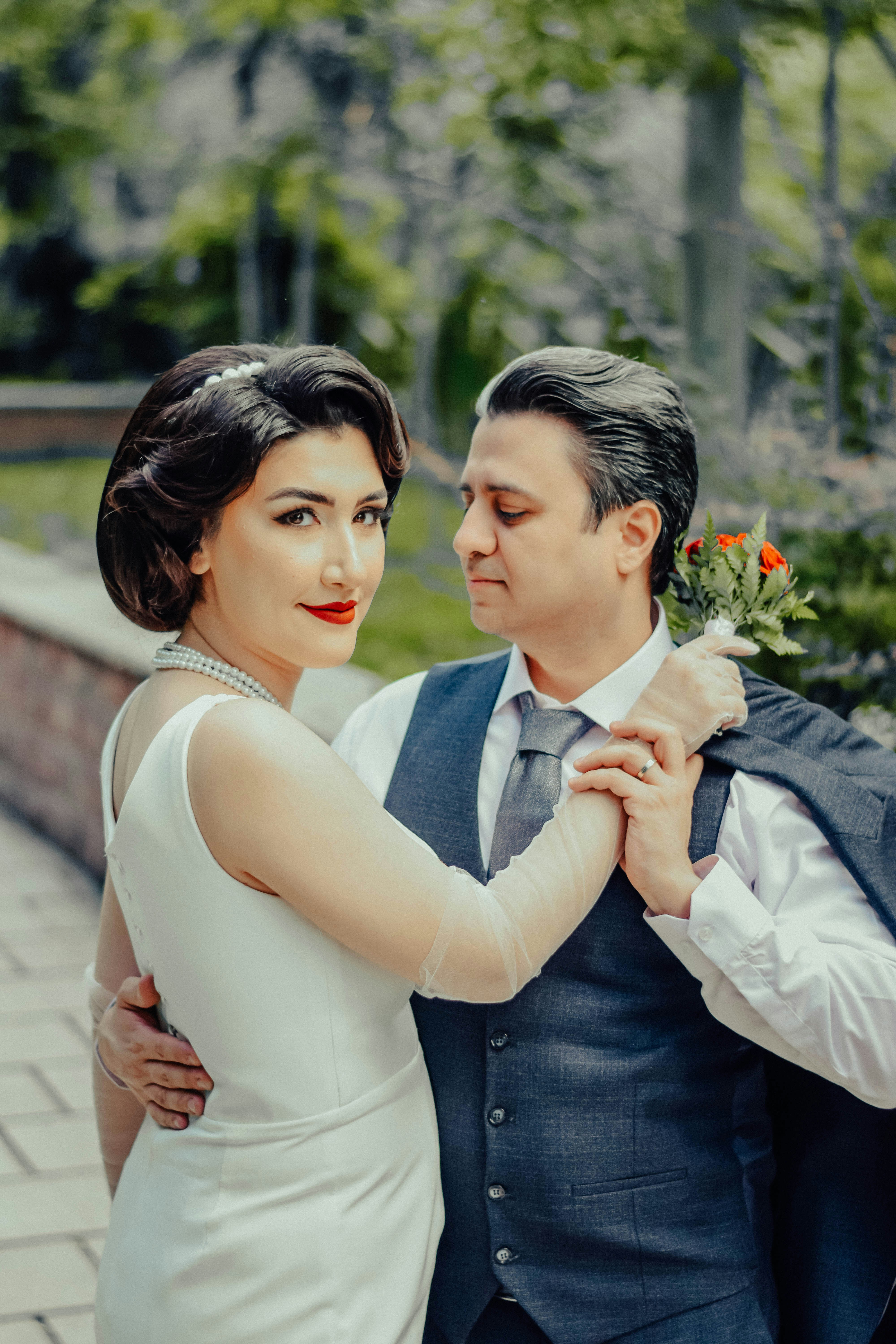 Veiled Vows: A Tender Spin of Red Lipstick and Groomed Grace